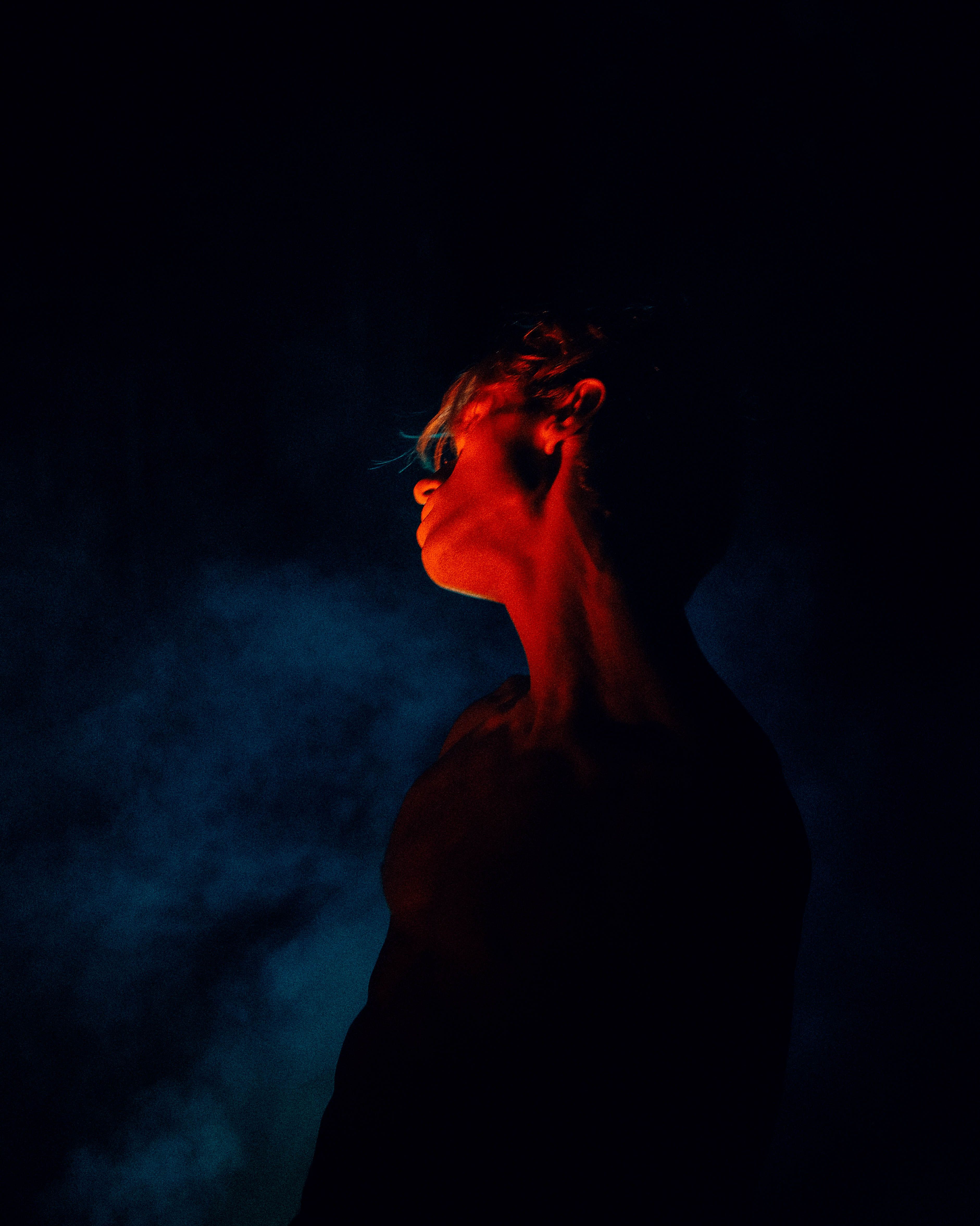 Photo of a Man Illuminated by a Red Light · Free Stock Photo
