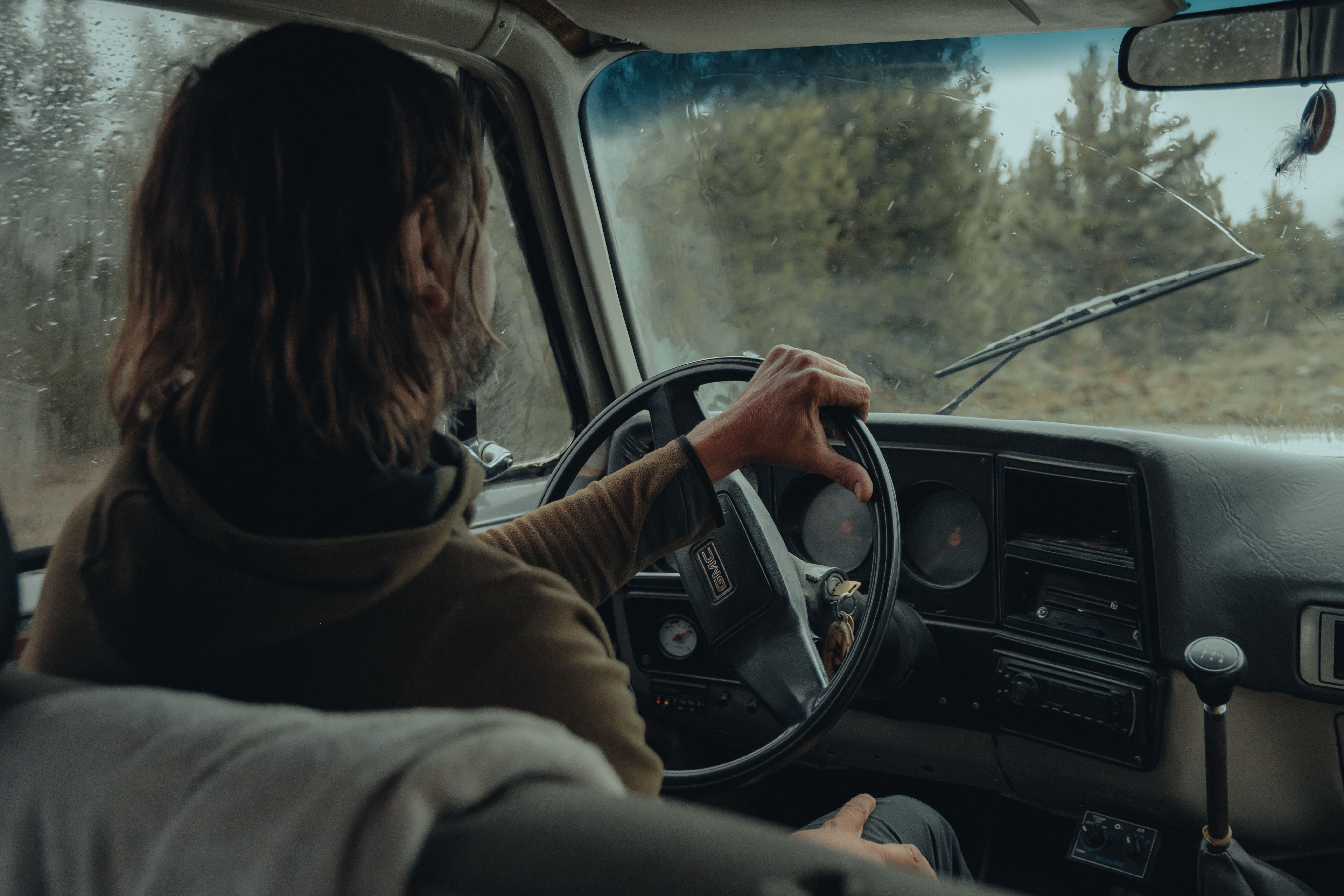 Back View of a Person Driving a Car · Free Stock Photo