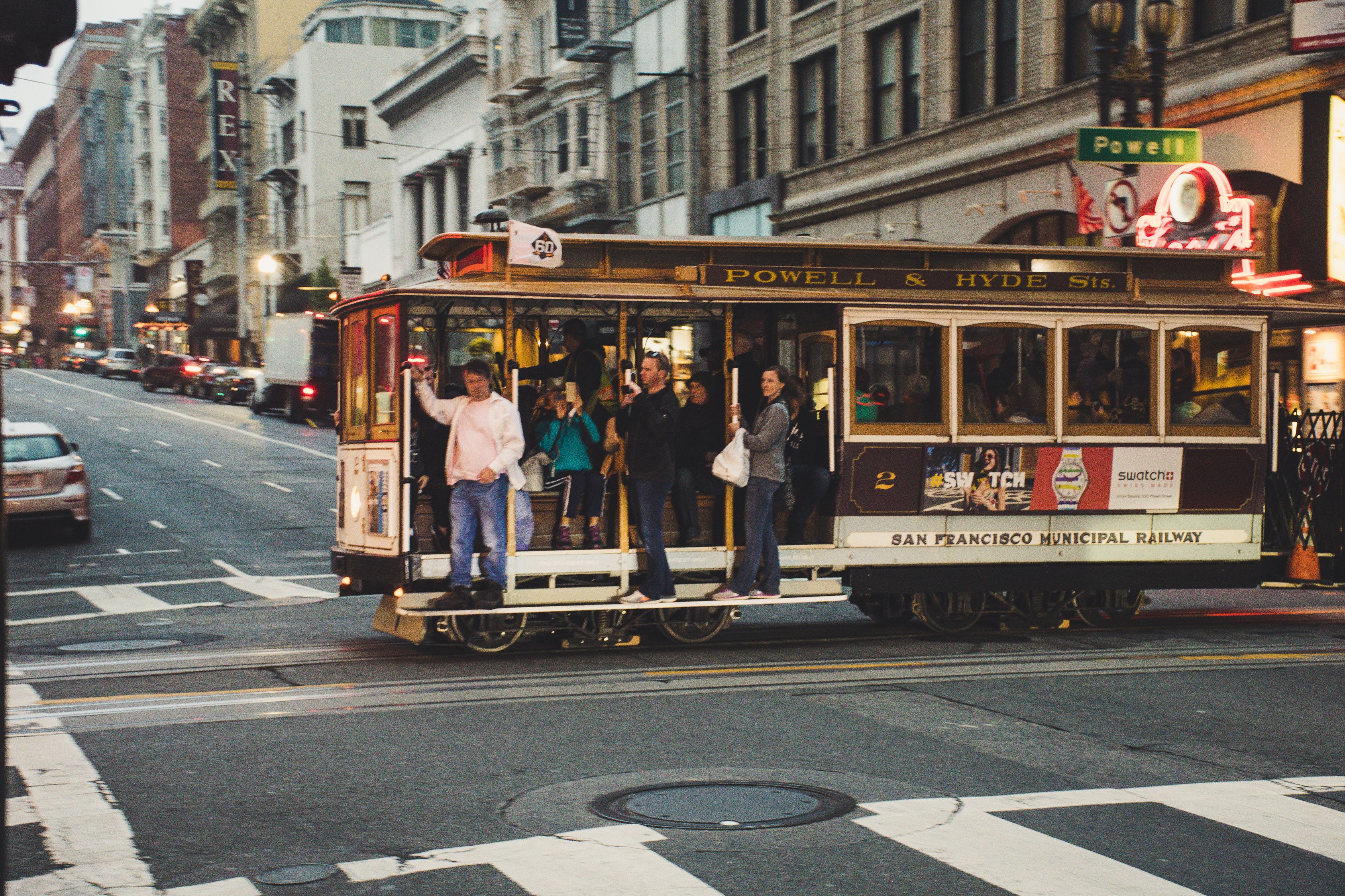 White And Black Bus Near White Building Free Stock Photo white-and-black-bus-near-white-building-free-stock-photo