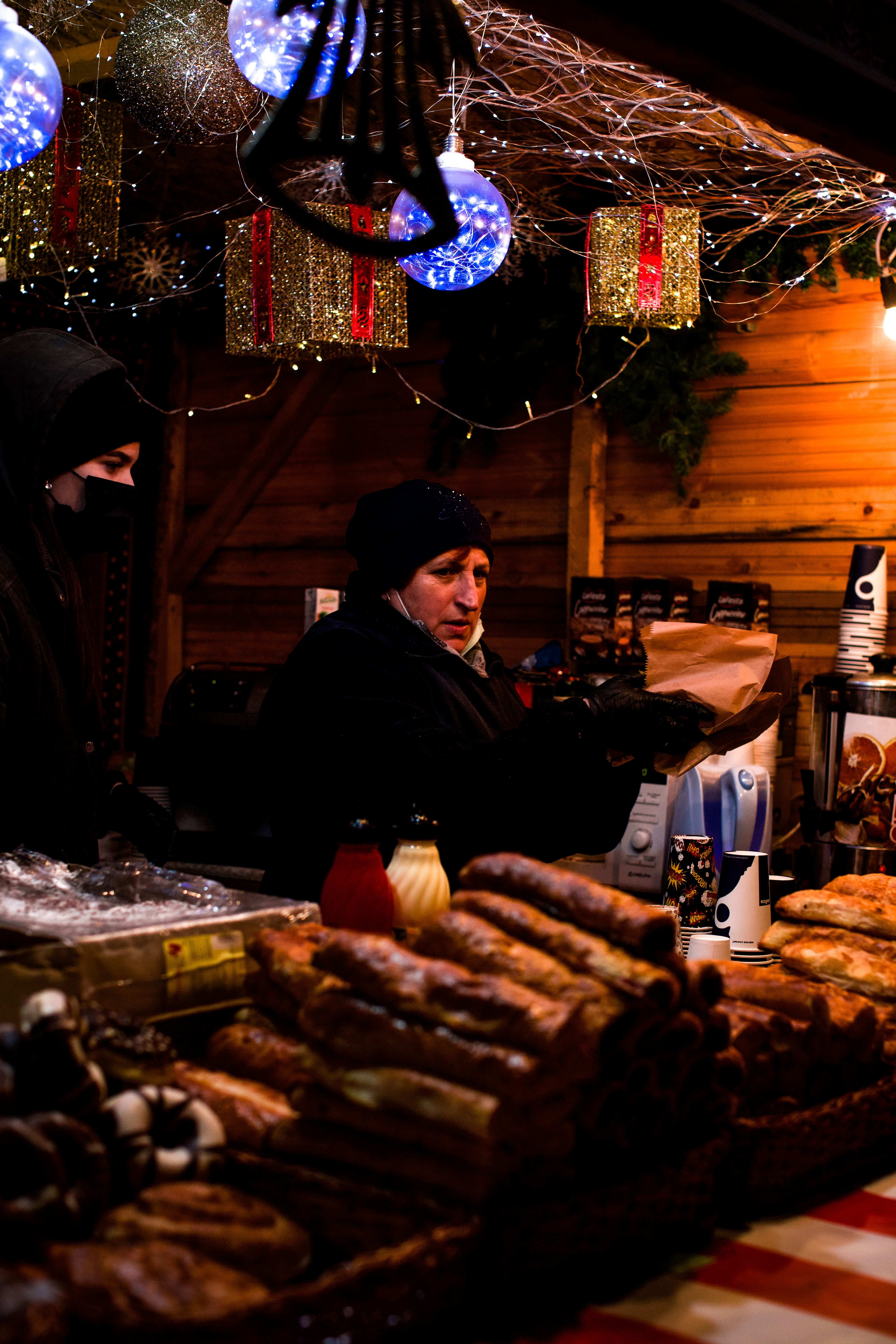Woman Selling Local Food on Christmas Market · Free Stock Photo