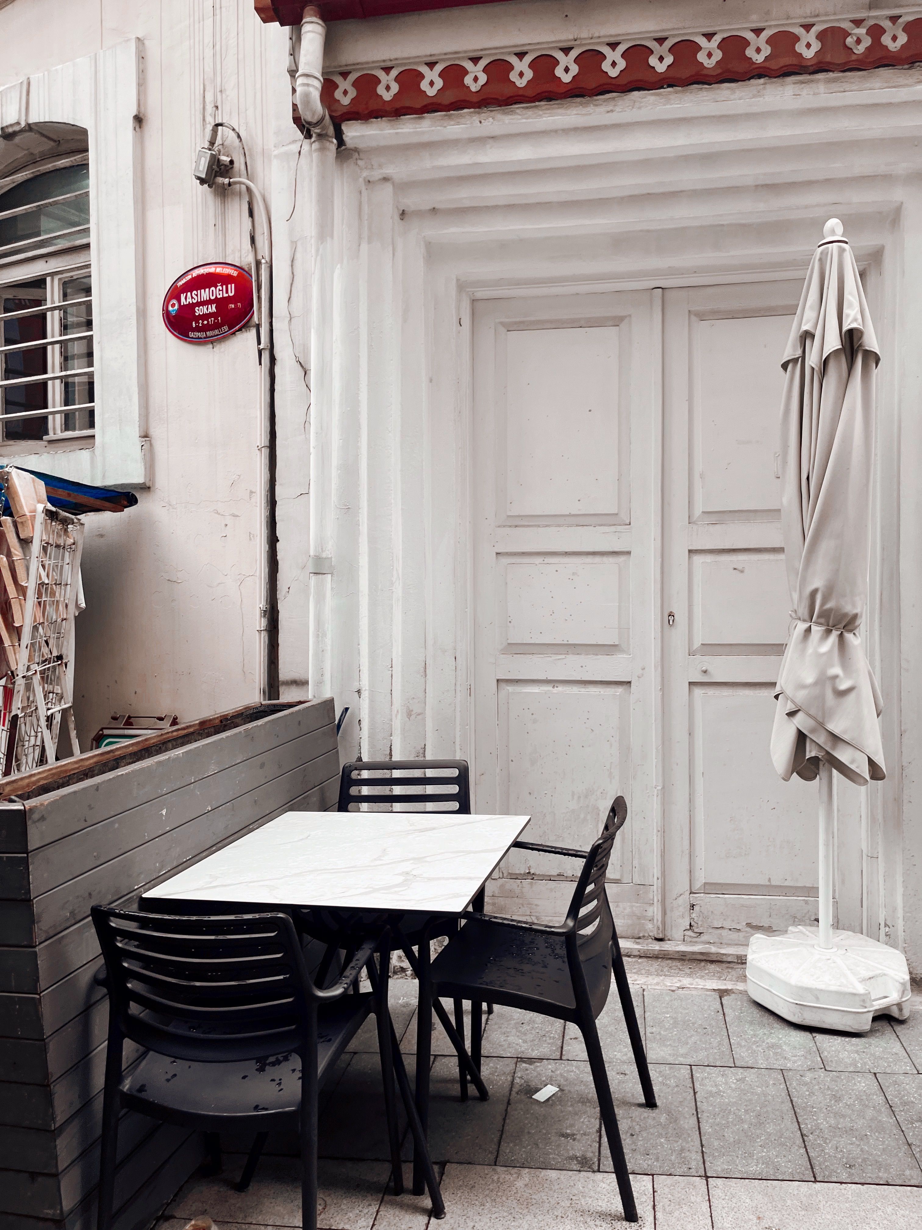 Chairs and Tables by Entrance to Bar · Free Stock Photo