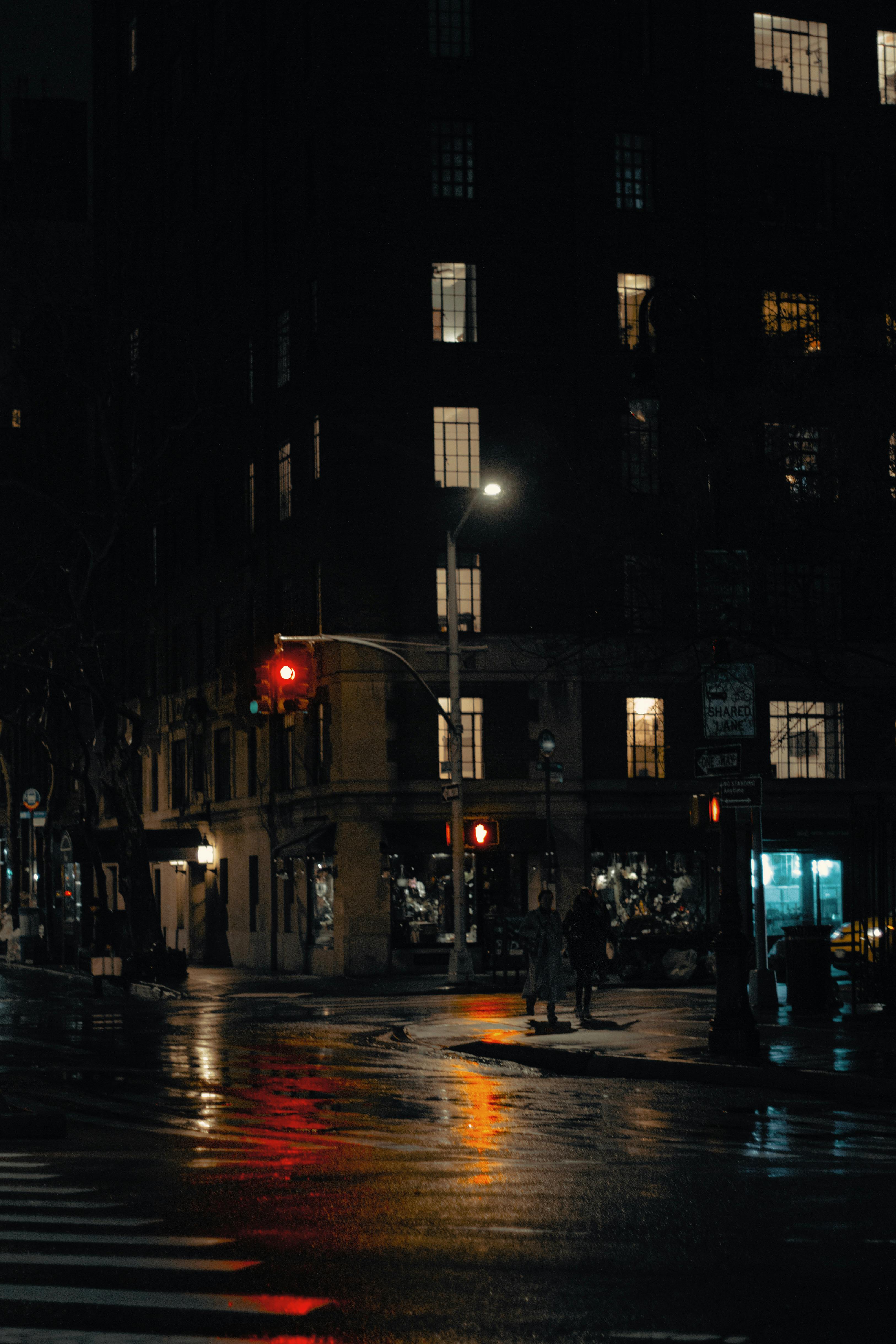 Traffic Light in a Town During Night Time · Free Stock Photo