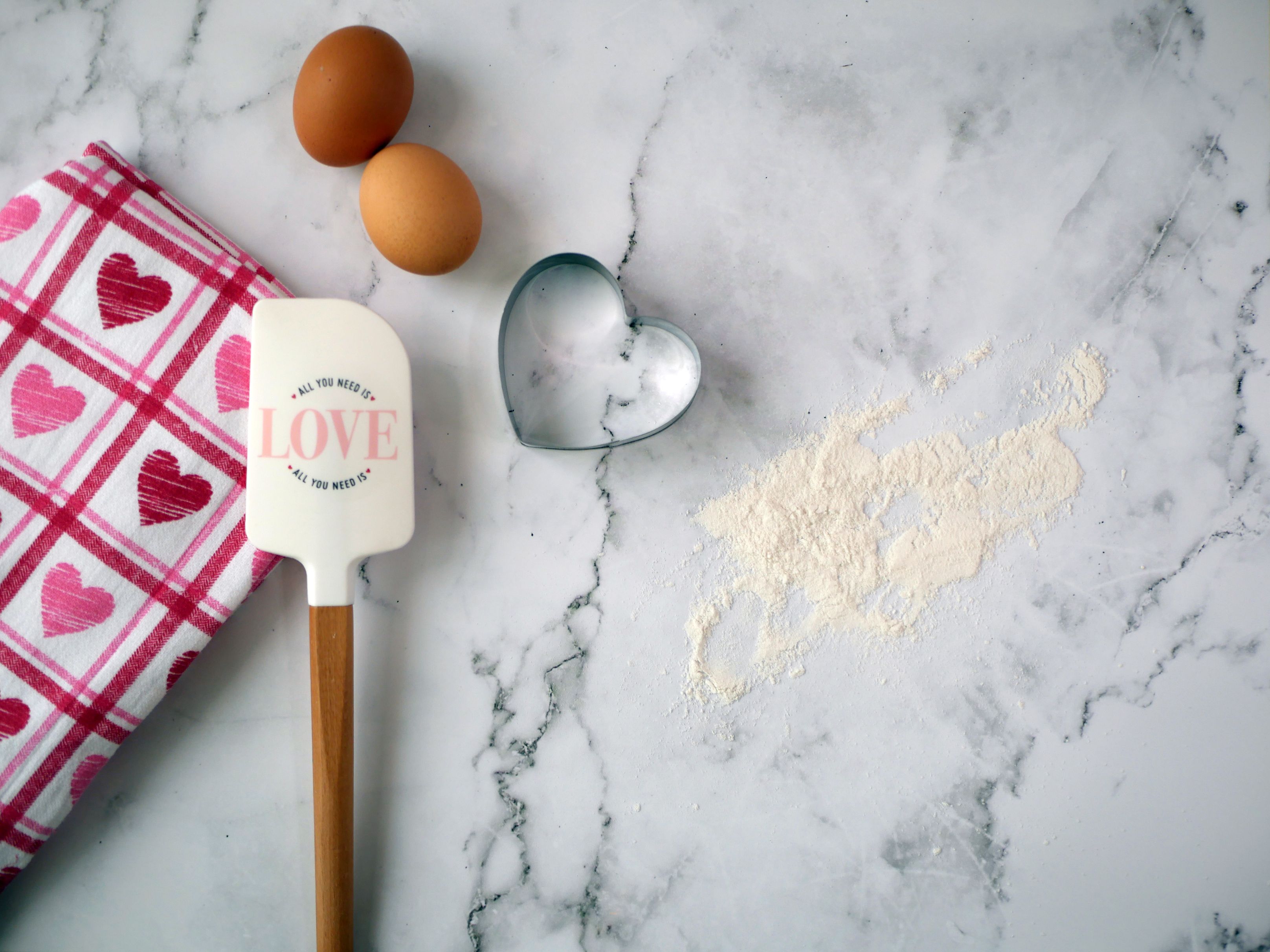Eggs and Baking Equipment on Marble Surface · Free Stock Photo