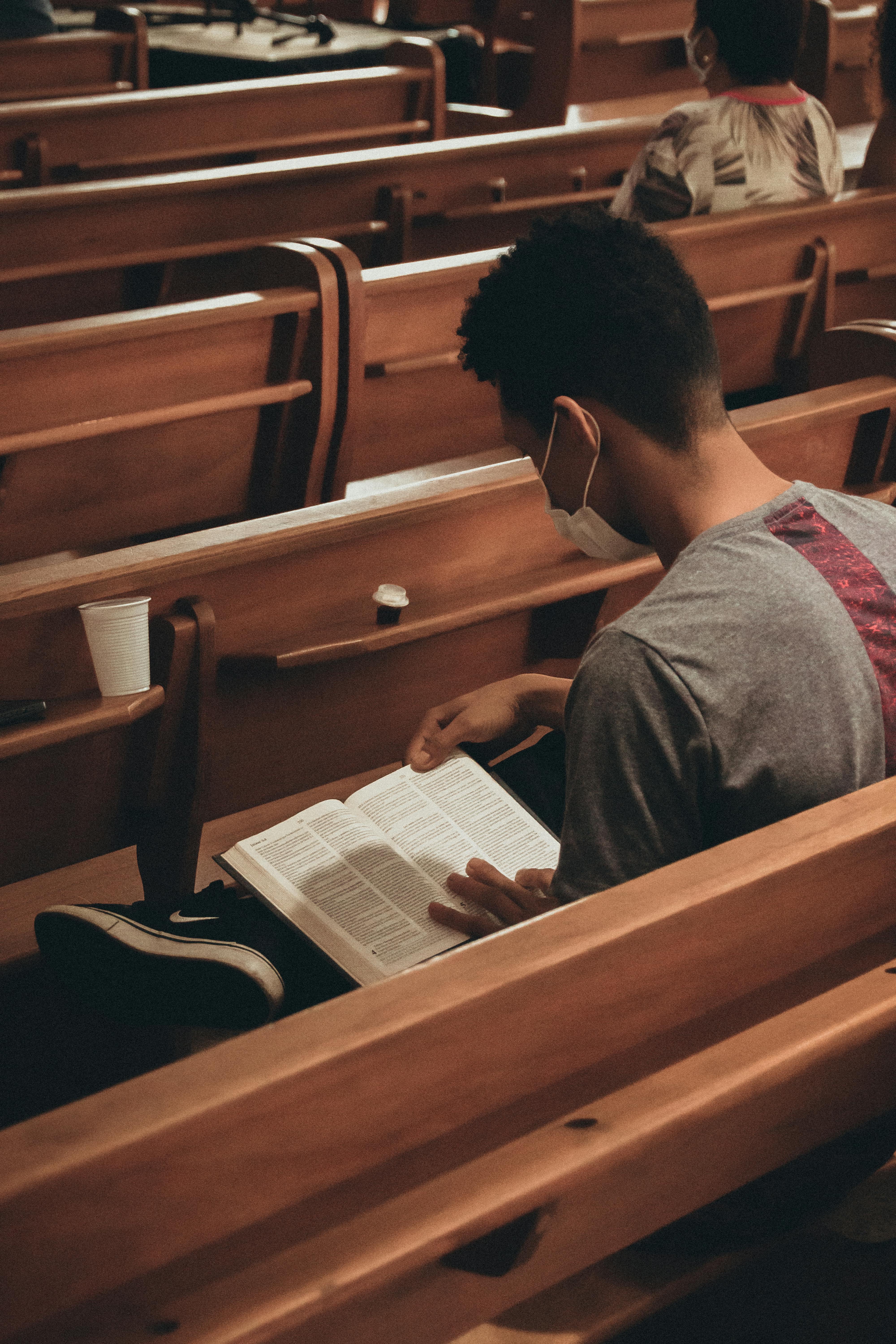Photo of a Man Reading a Bible · Free Stock Photo
