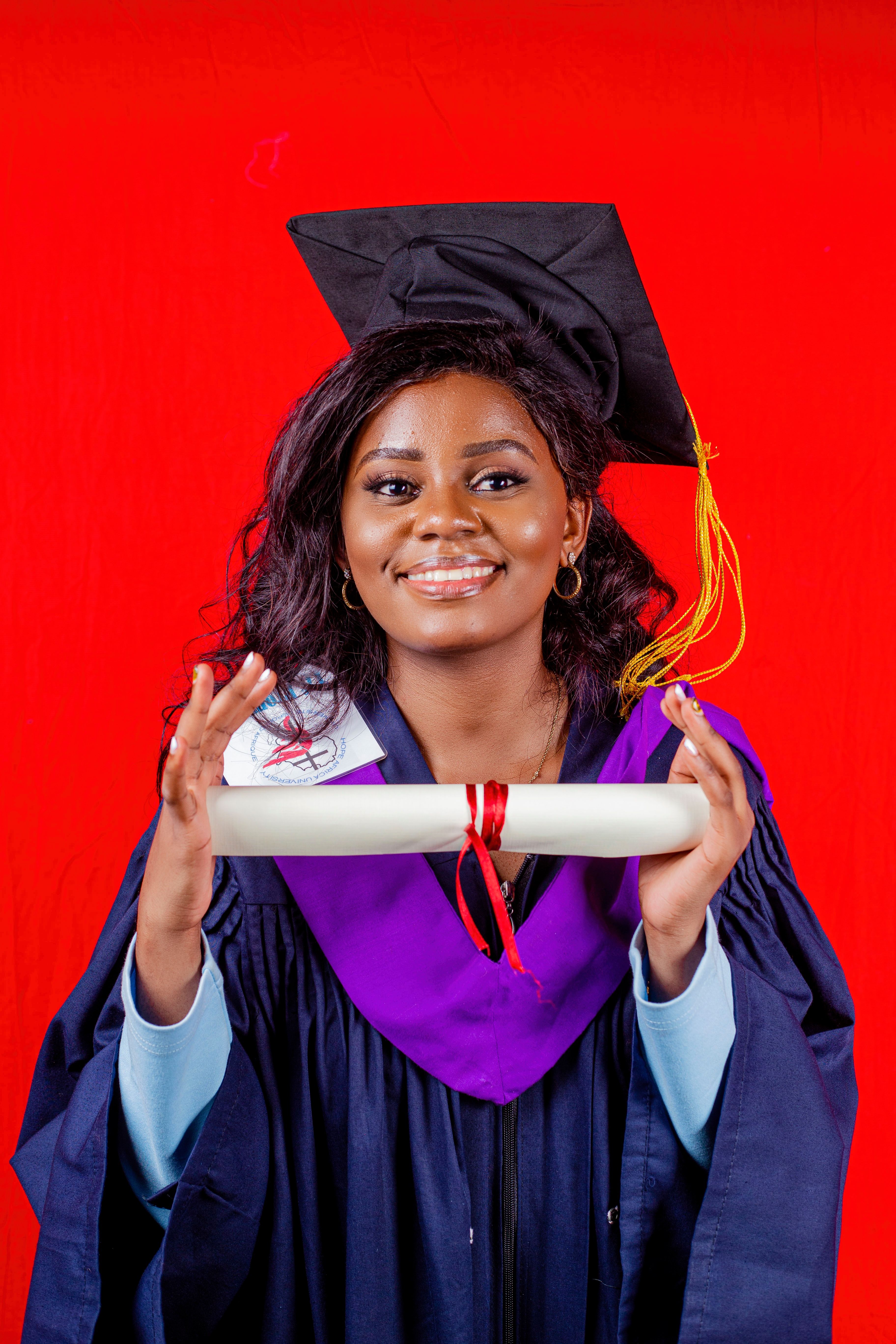 A Woman Posing with Her Diploma · Free Stock Photo