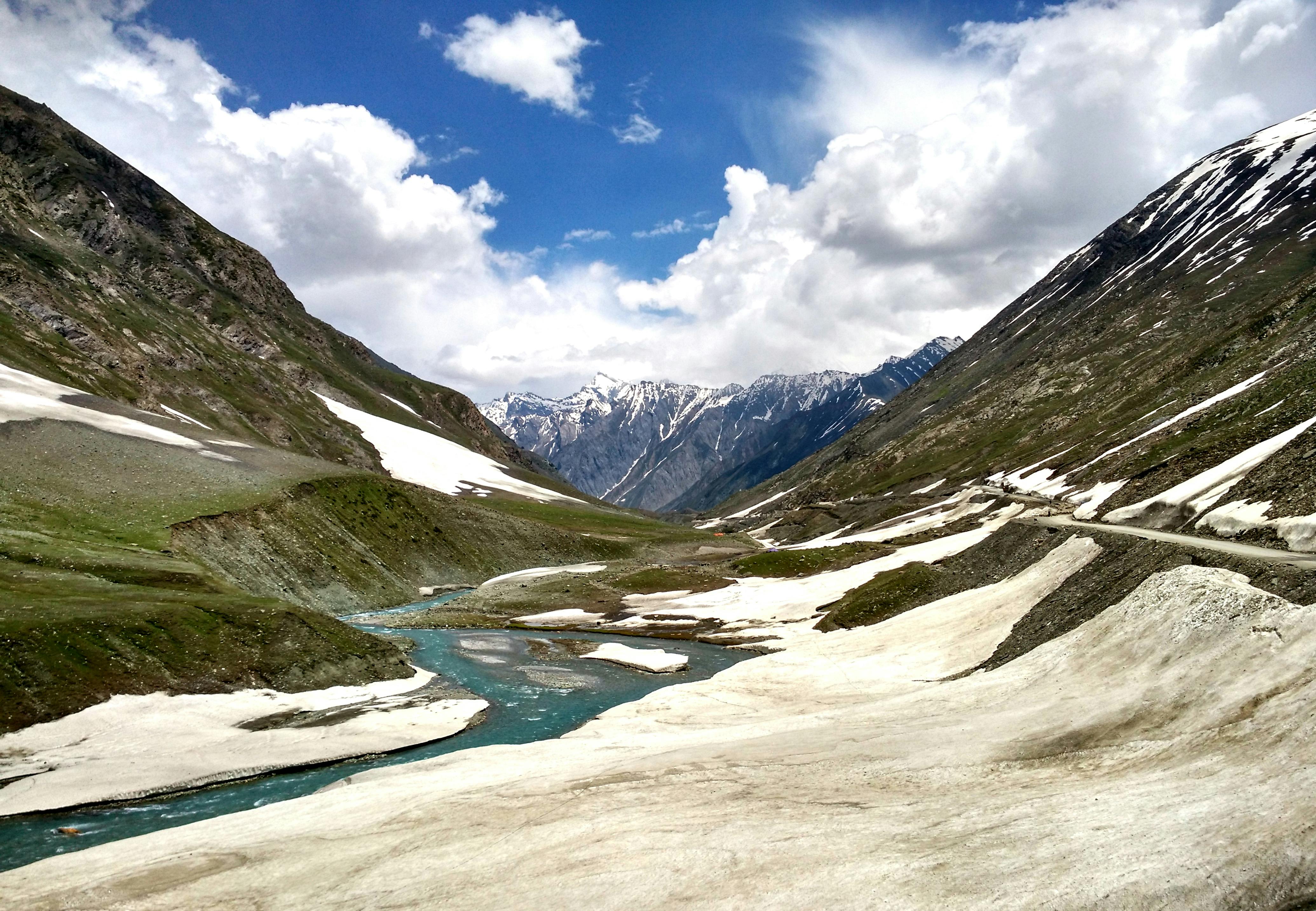 River in Between Mountains · Free Stock Photo