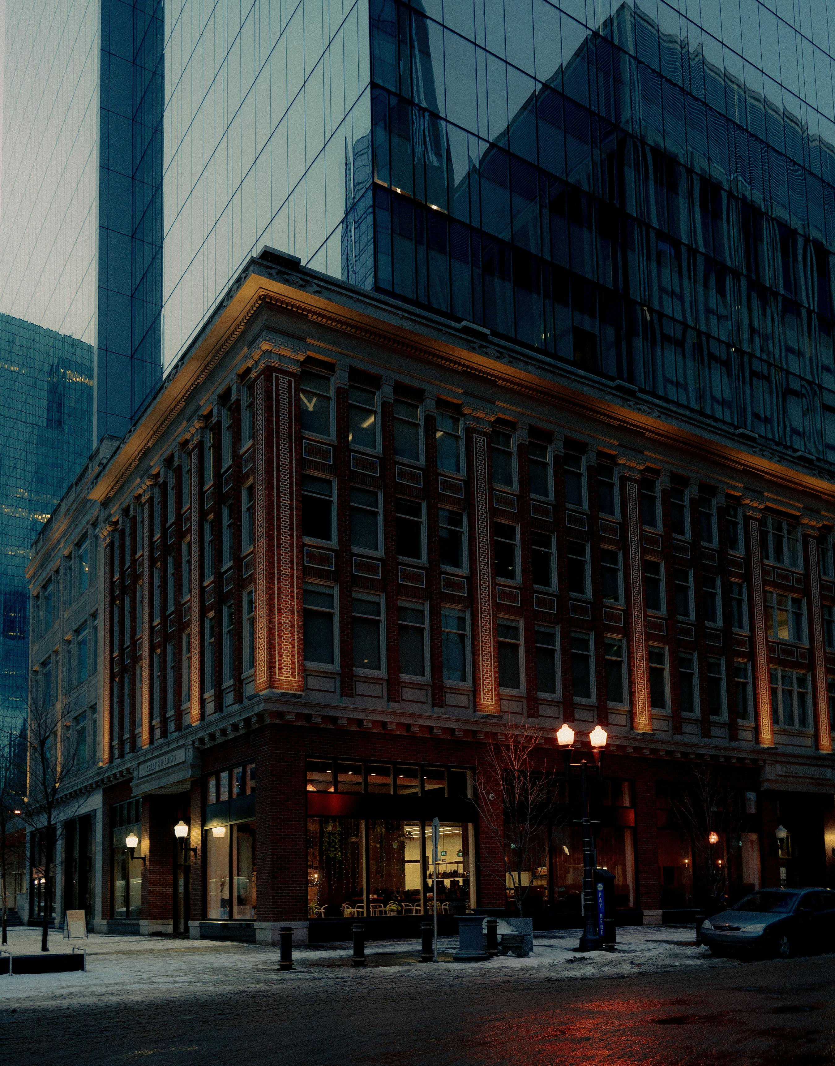 An Illuminated Building by a River · Free Stock Photo