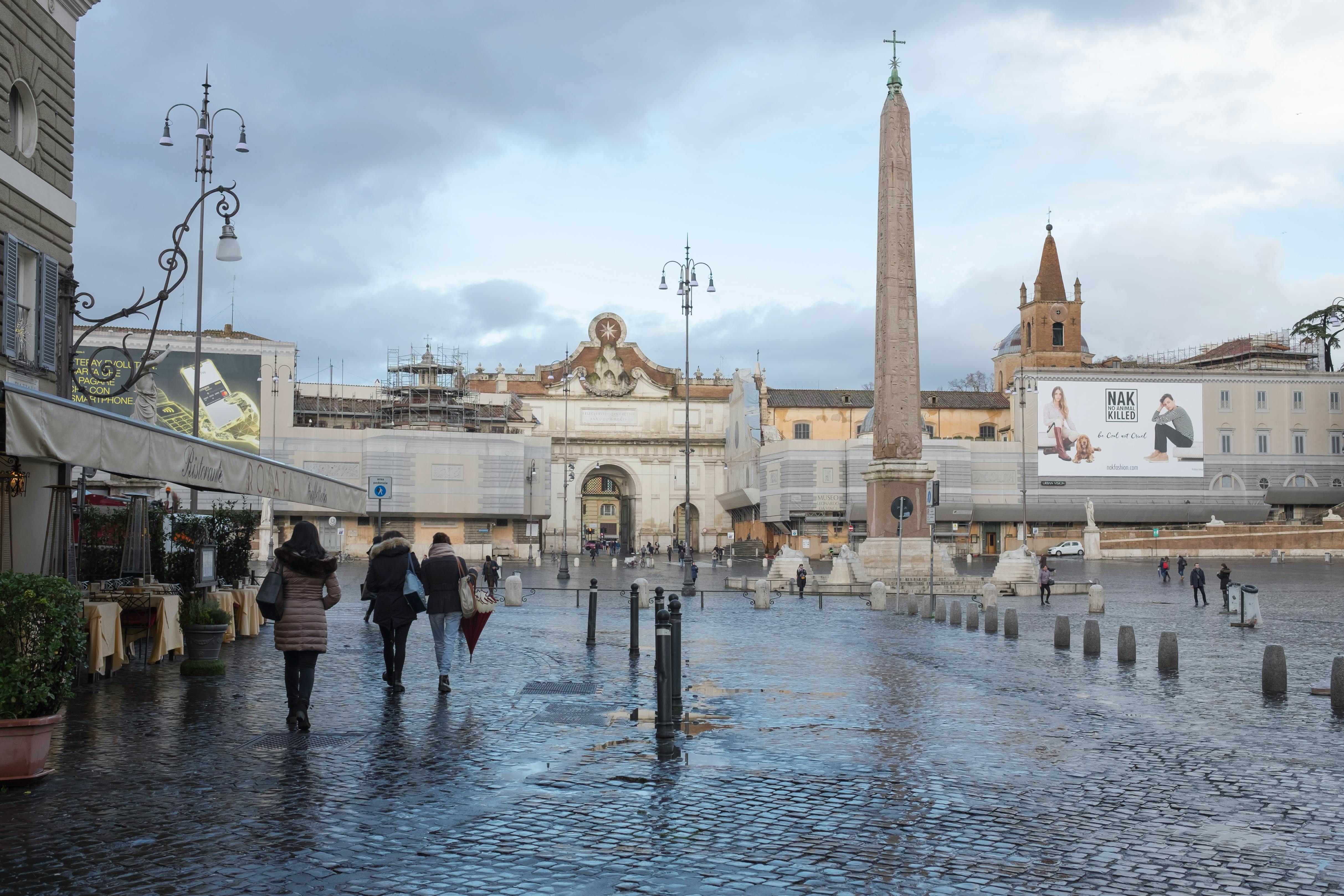 Old city square with monument in center · Free Stock Photo