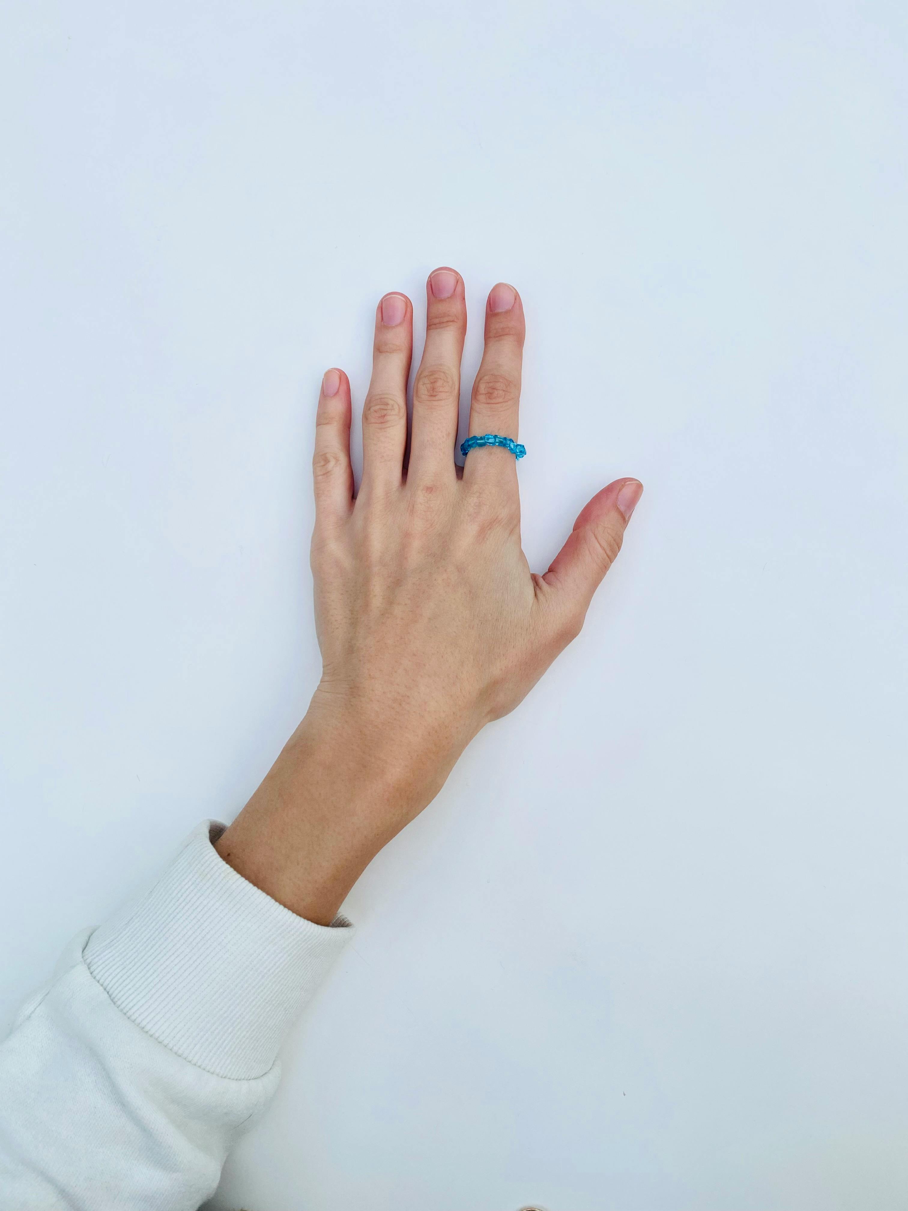 Woman Wearing Blue Gemstone Ring · Free Stock Photo