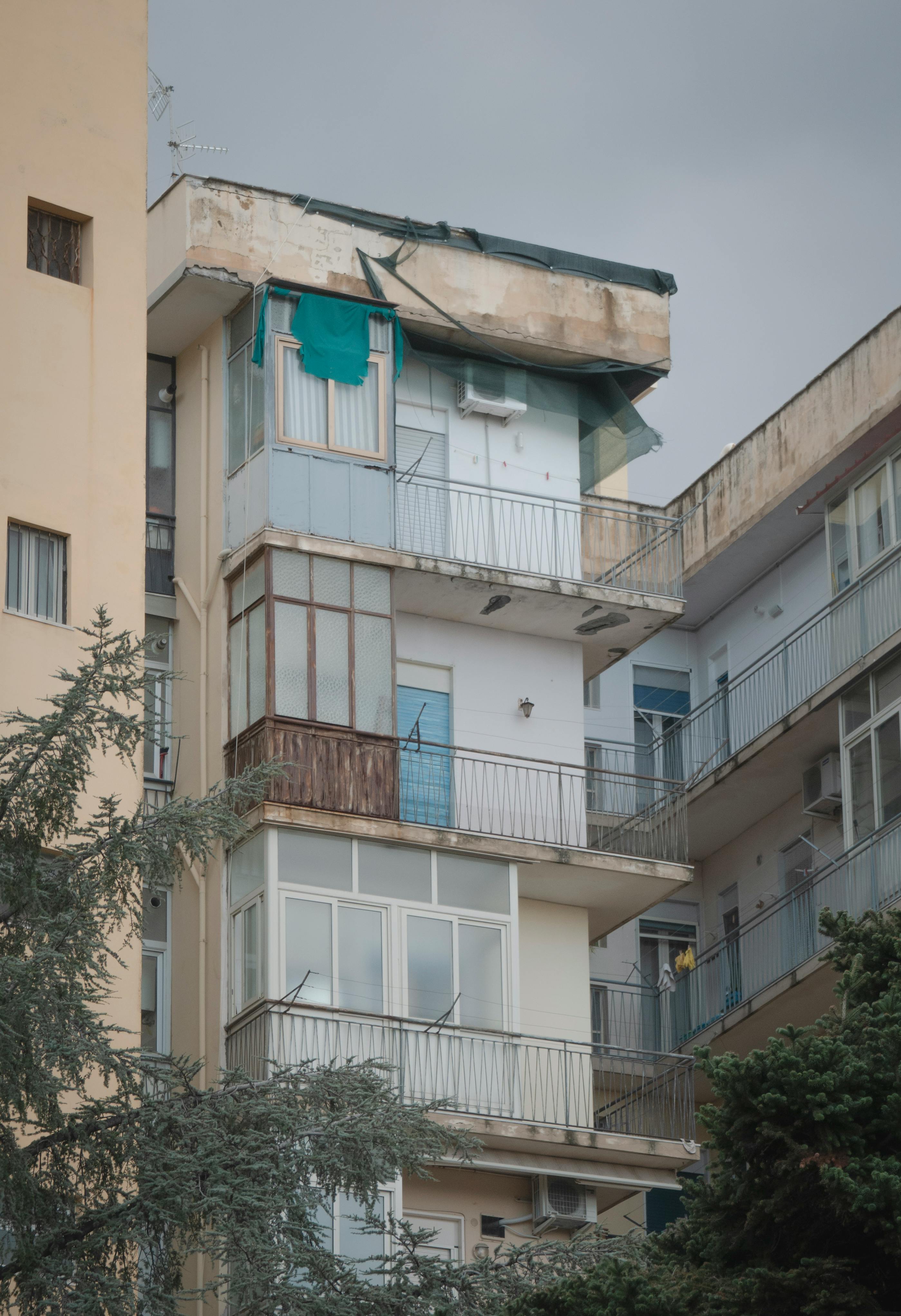 Person Hanging on a High Rise Building · Free Stock Photo