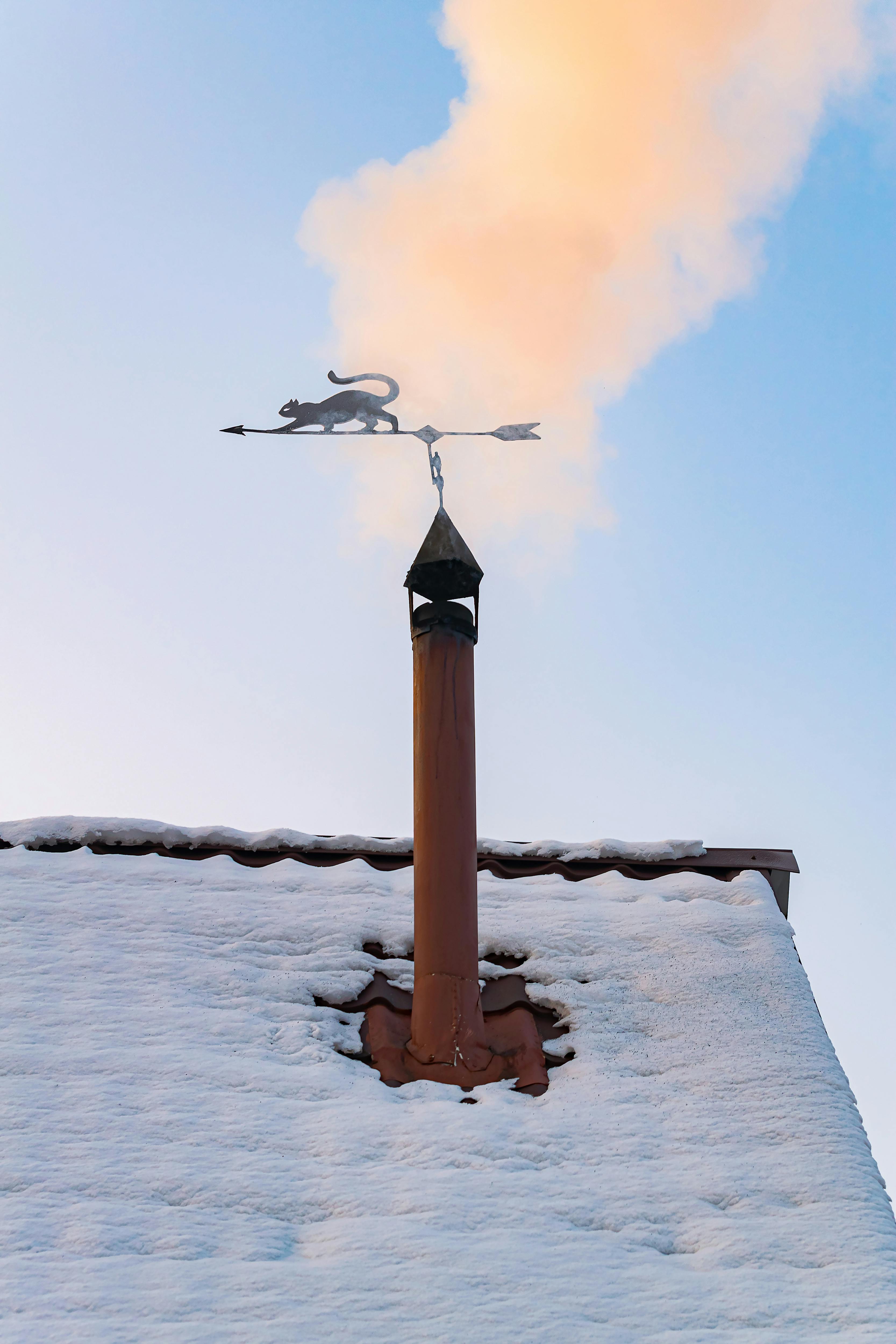 Smoke Coming Out of Industrial Chimneys in Distance Across a Snowy ...