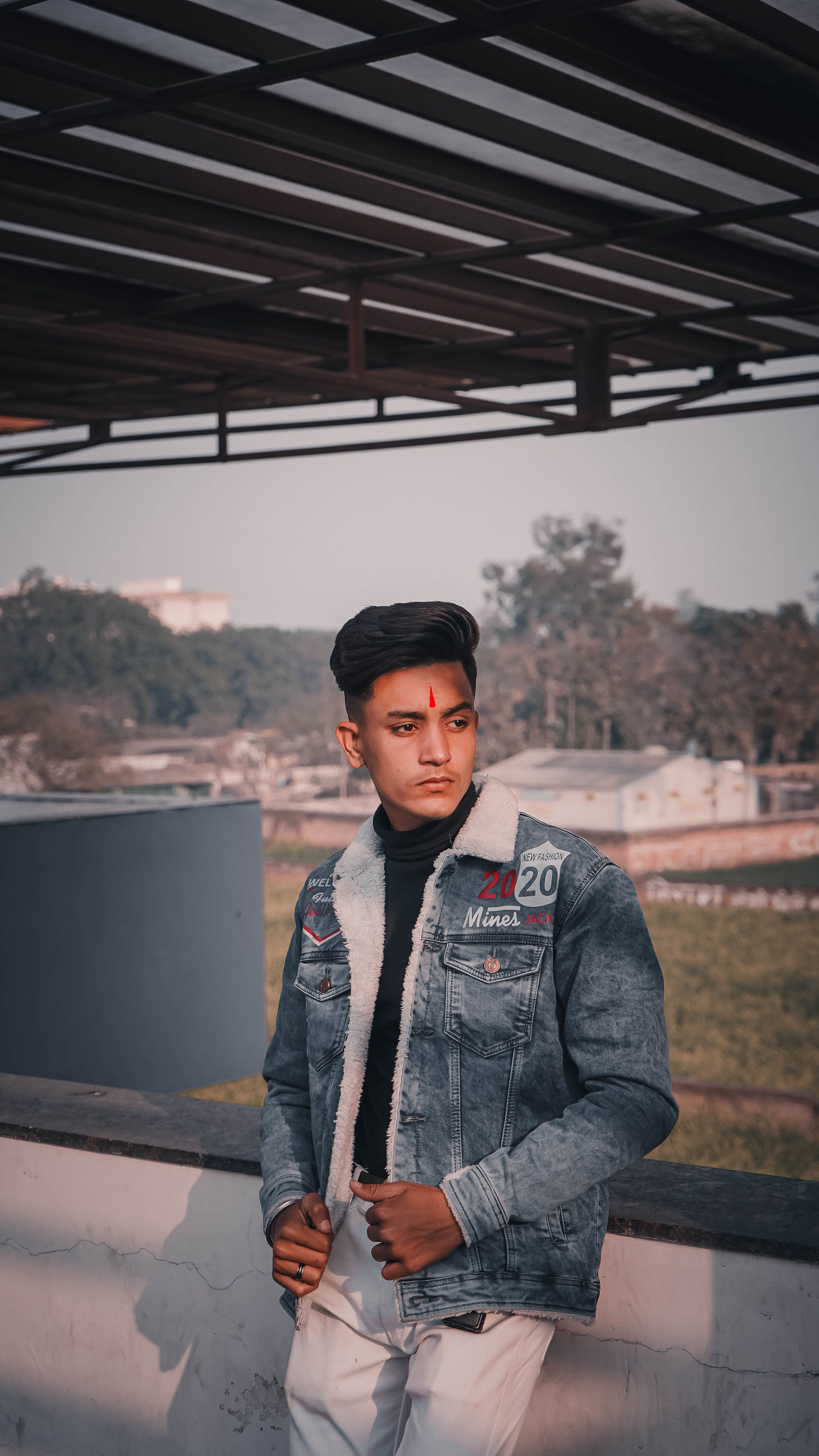 Man Posing in Denim Jacket · Free Stock Photo