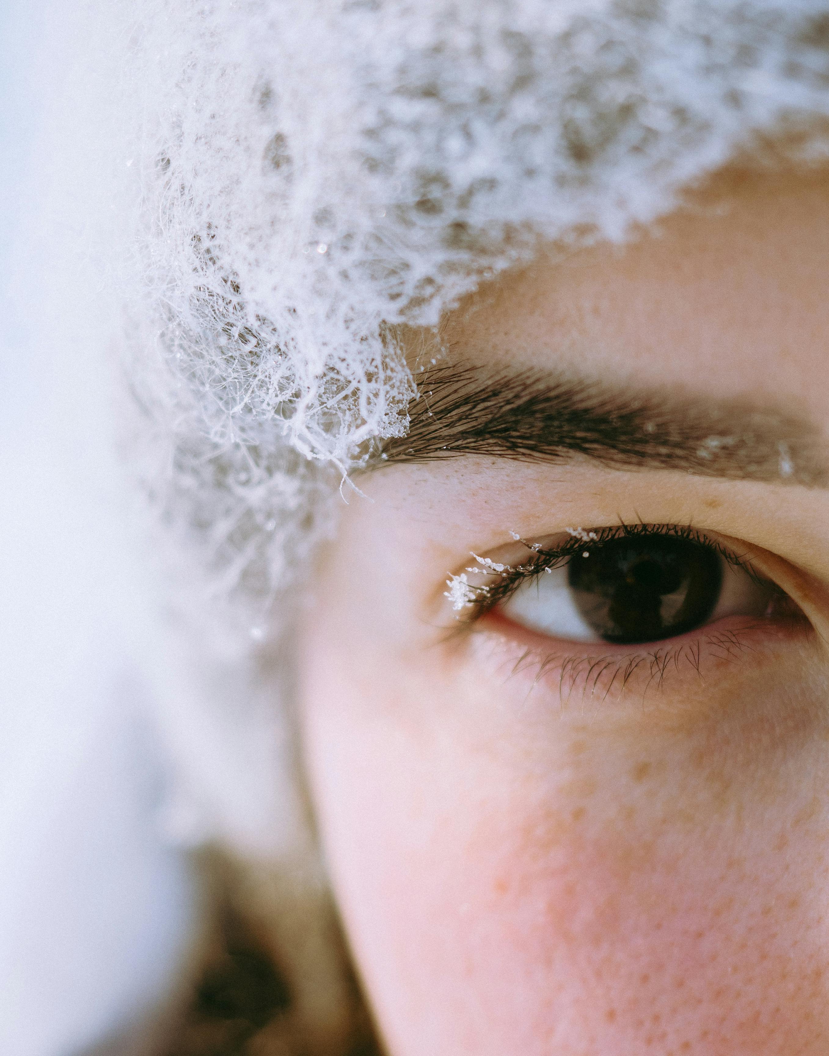 Close View of Woman Brown Eye and Snow on Eyelashes · Free Stock Photo