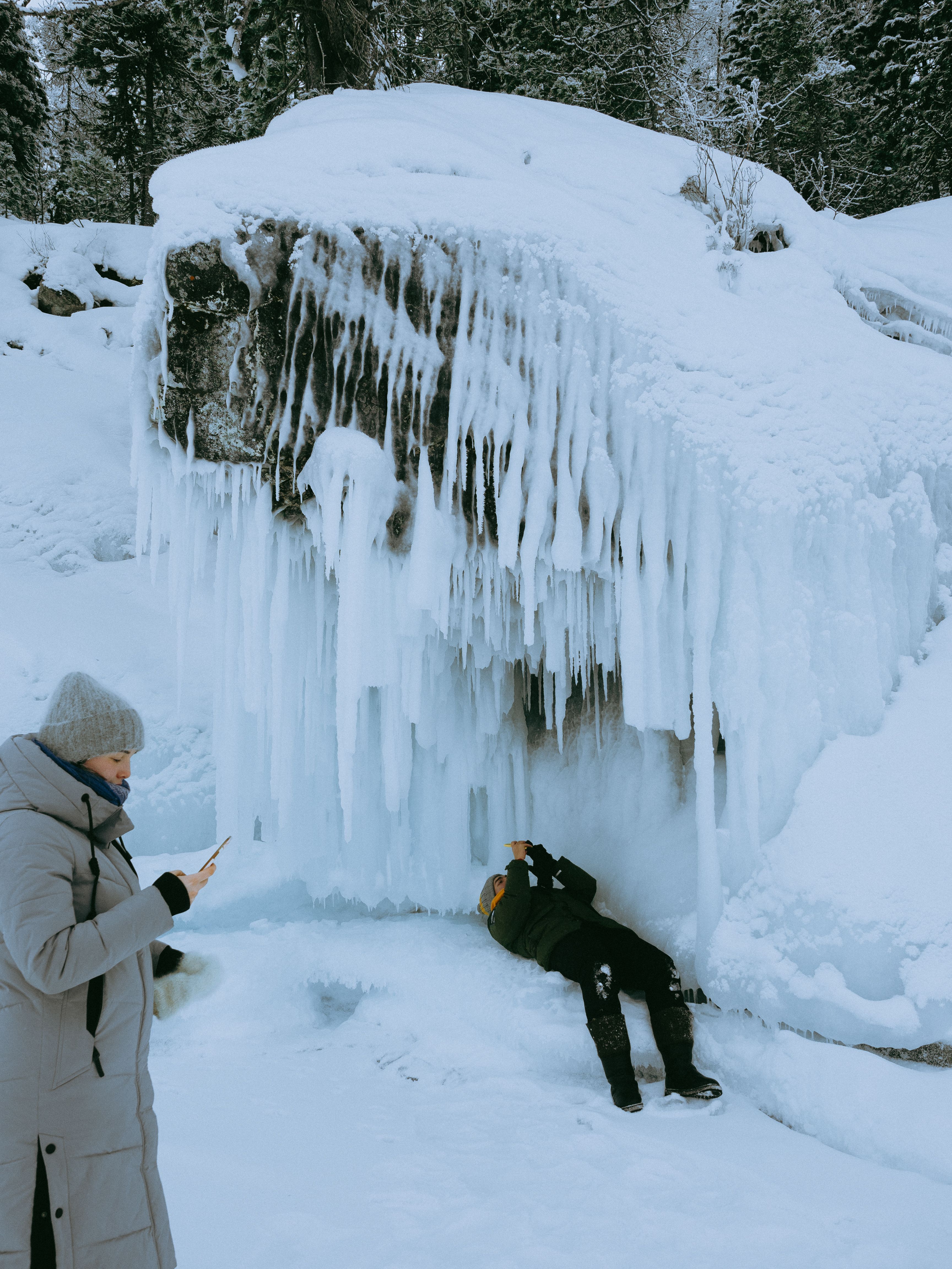People Photographing Icicles · Free Stock Photo