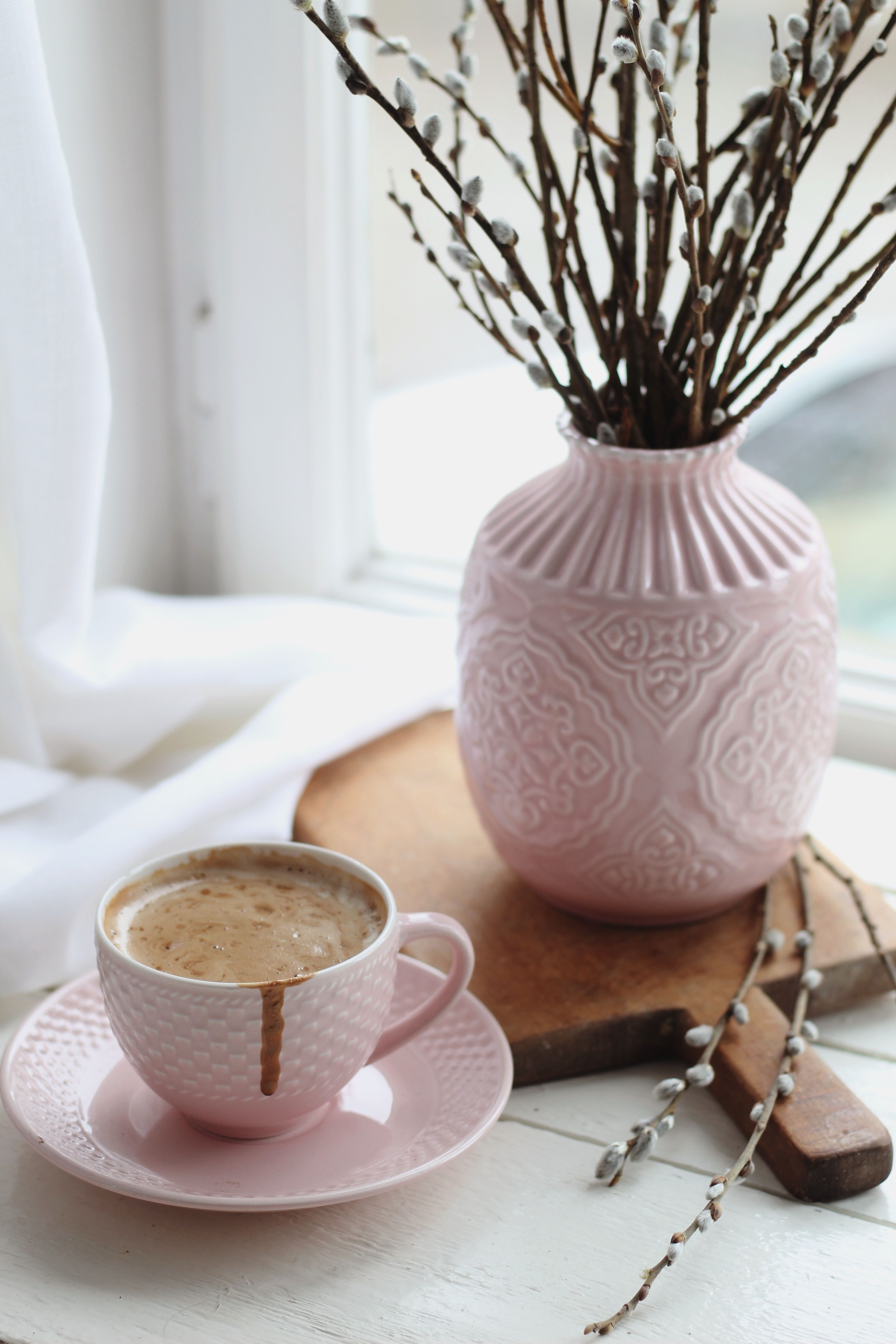 Coffee Cup and Branches in Vase · Free Stock Photo
