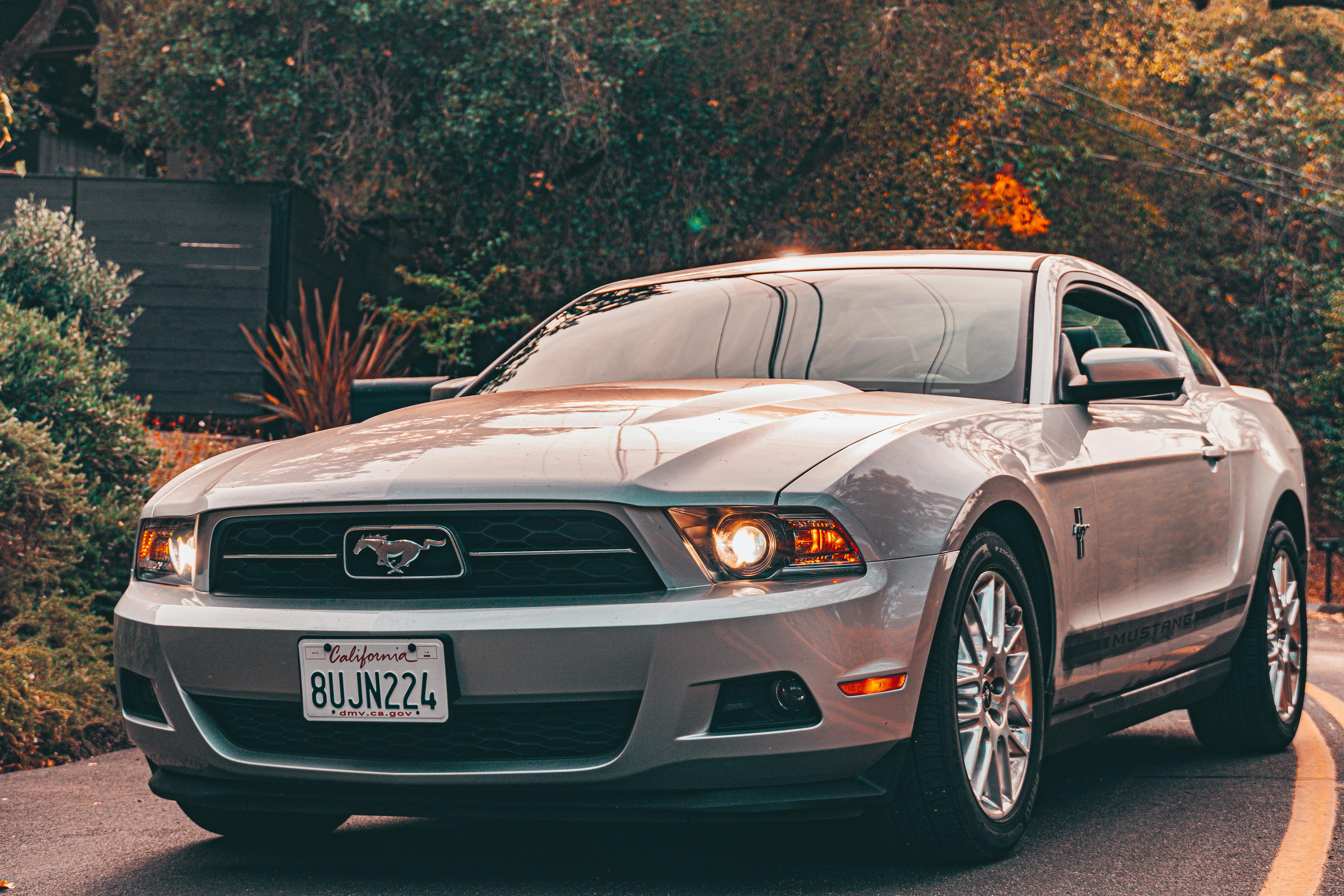 Close-Up Shot of a Silver Ford Mustang · Free Stock Photo