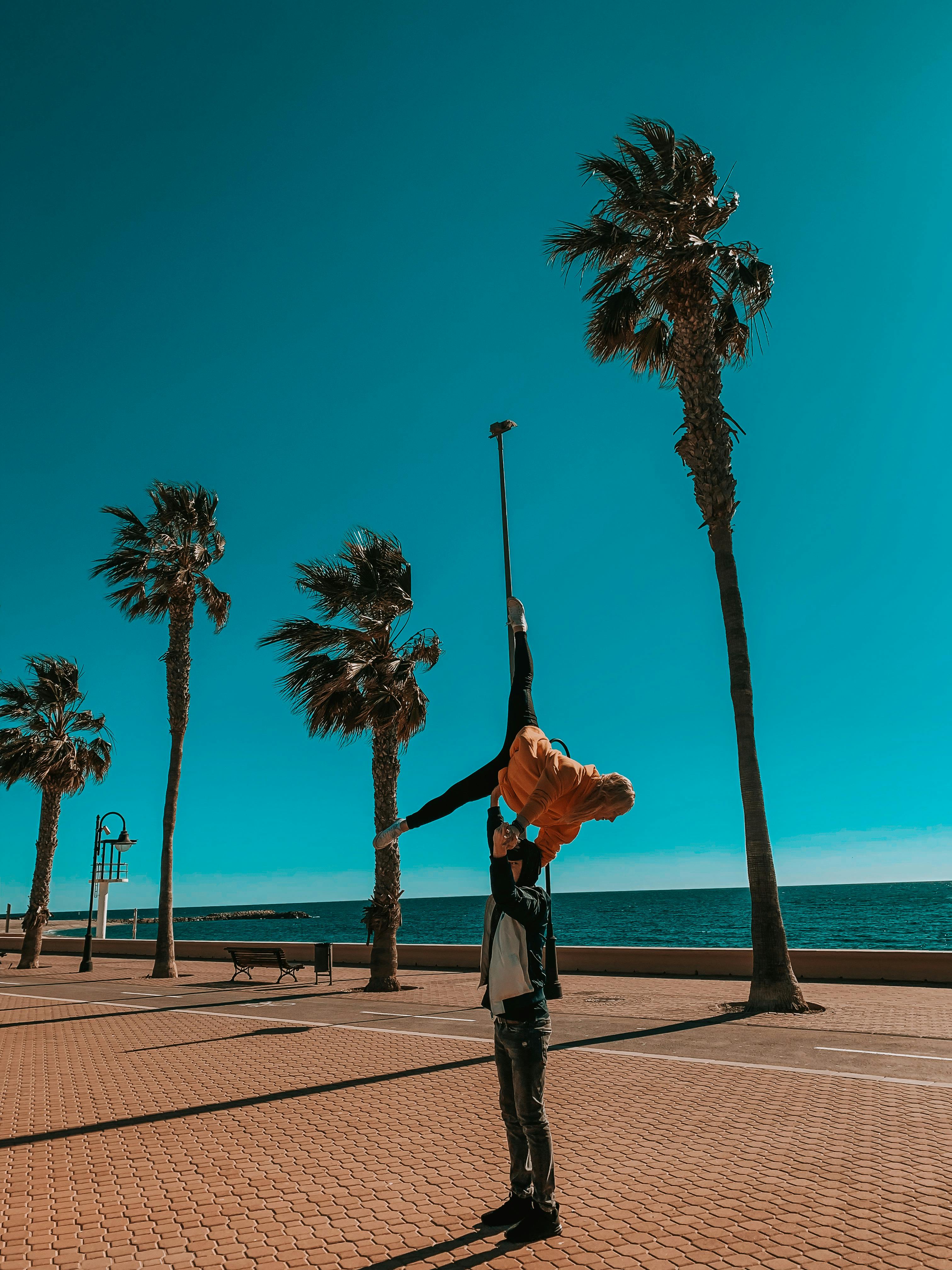Relief on Wall of People Dancing around Tree · Free Stock Photo