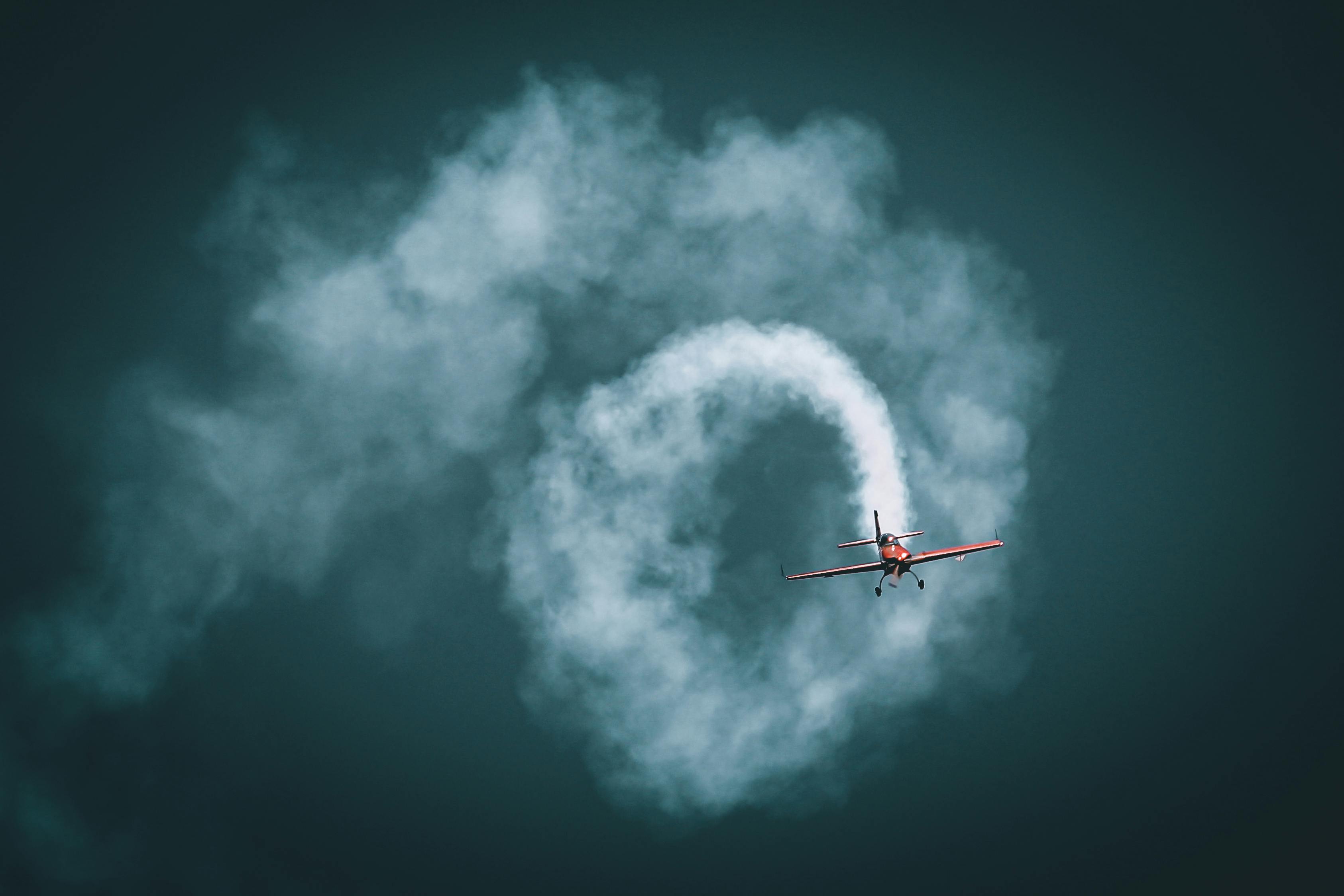 An Aircraft Leaving a Trail of Smoke · Free Stock Photo
