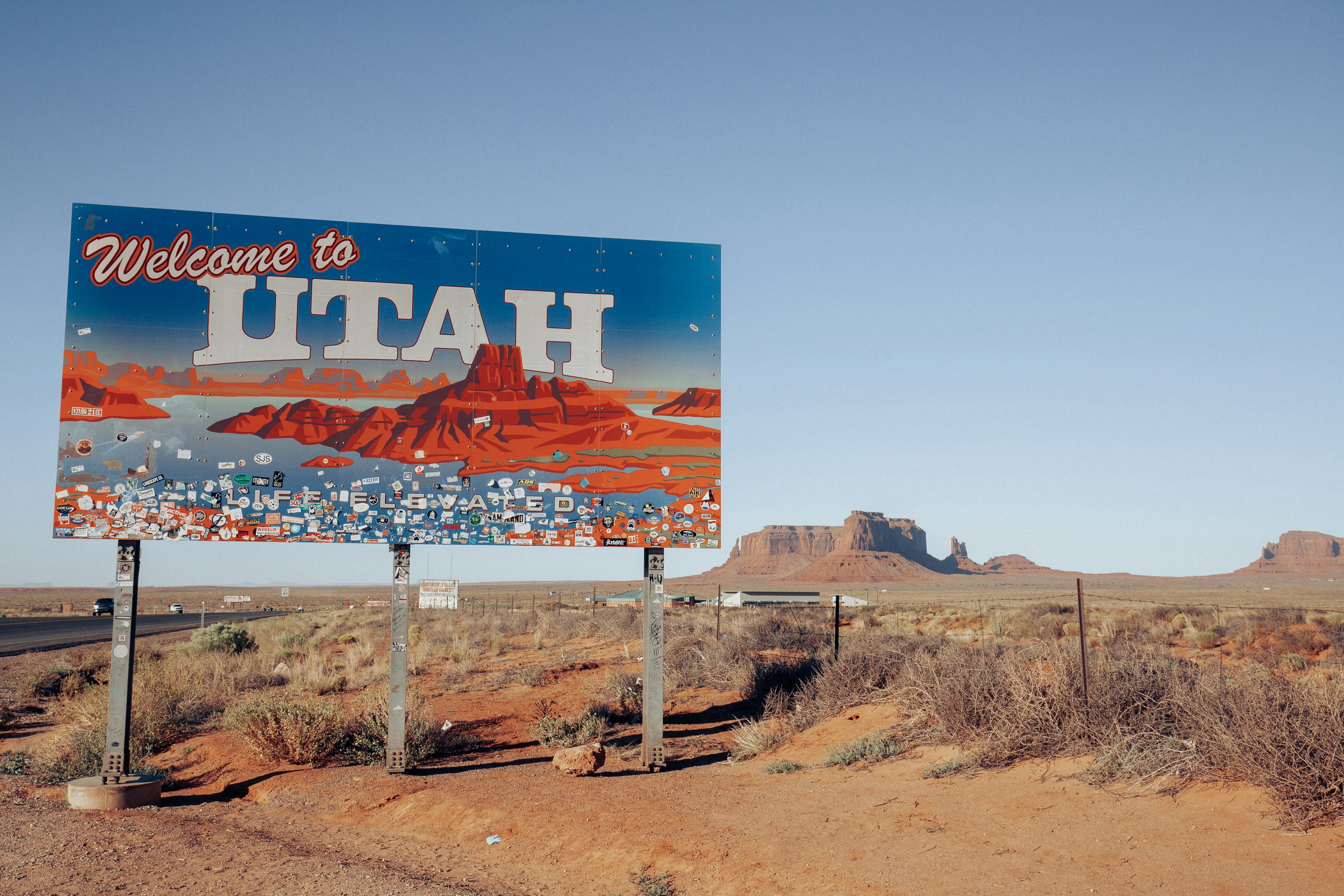 Utah State Line Sign Under Blue Sky · Free Stock Photo