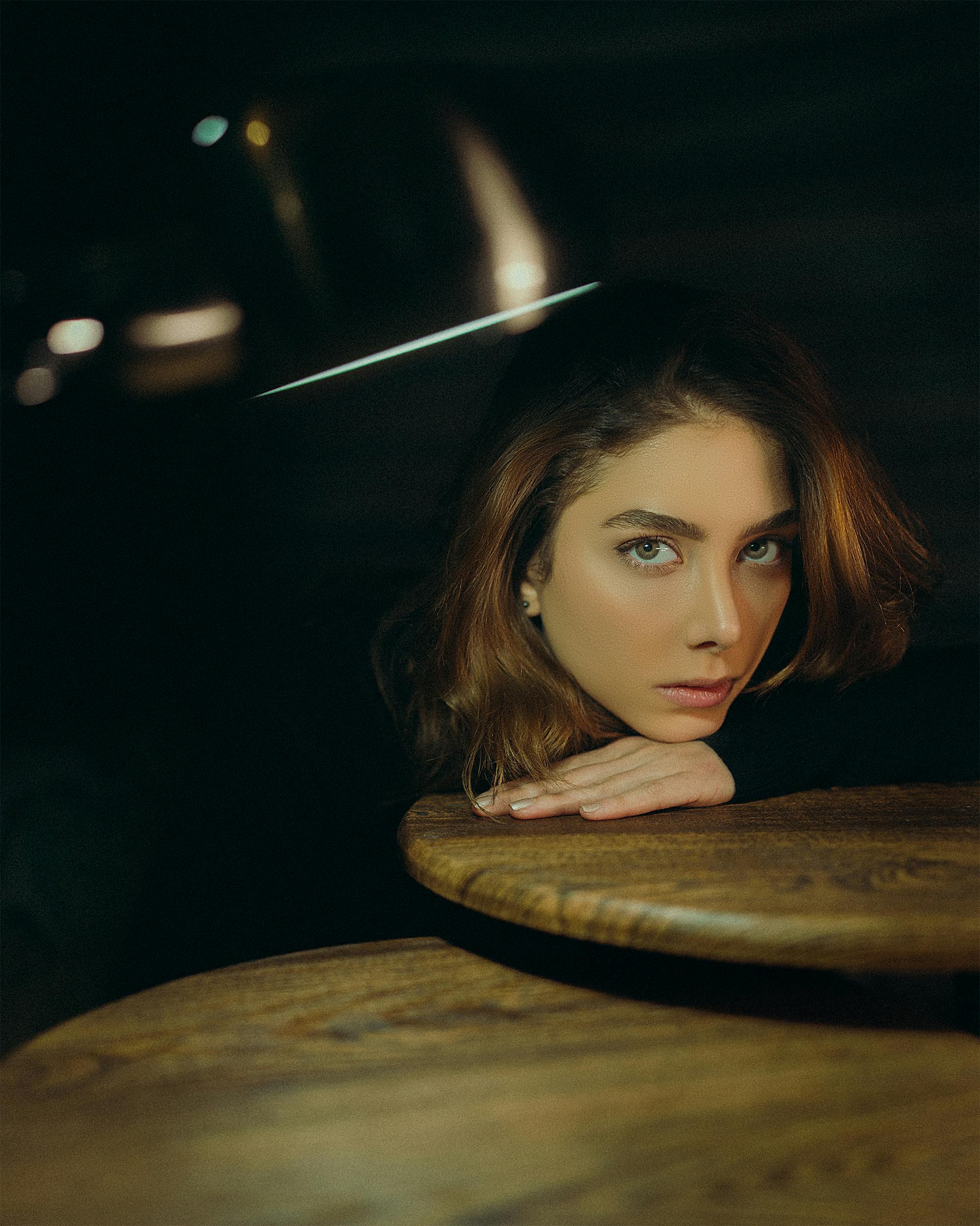 Beautiful Woman Leaning on Round Table · Free Stock Photo