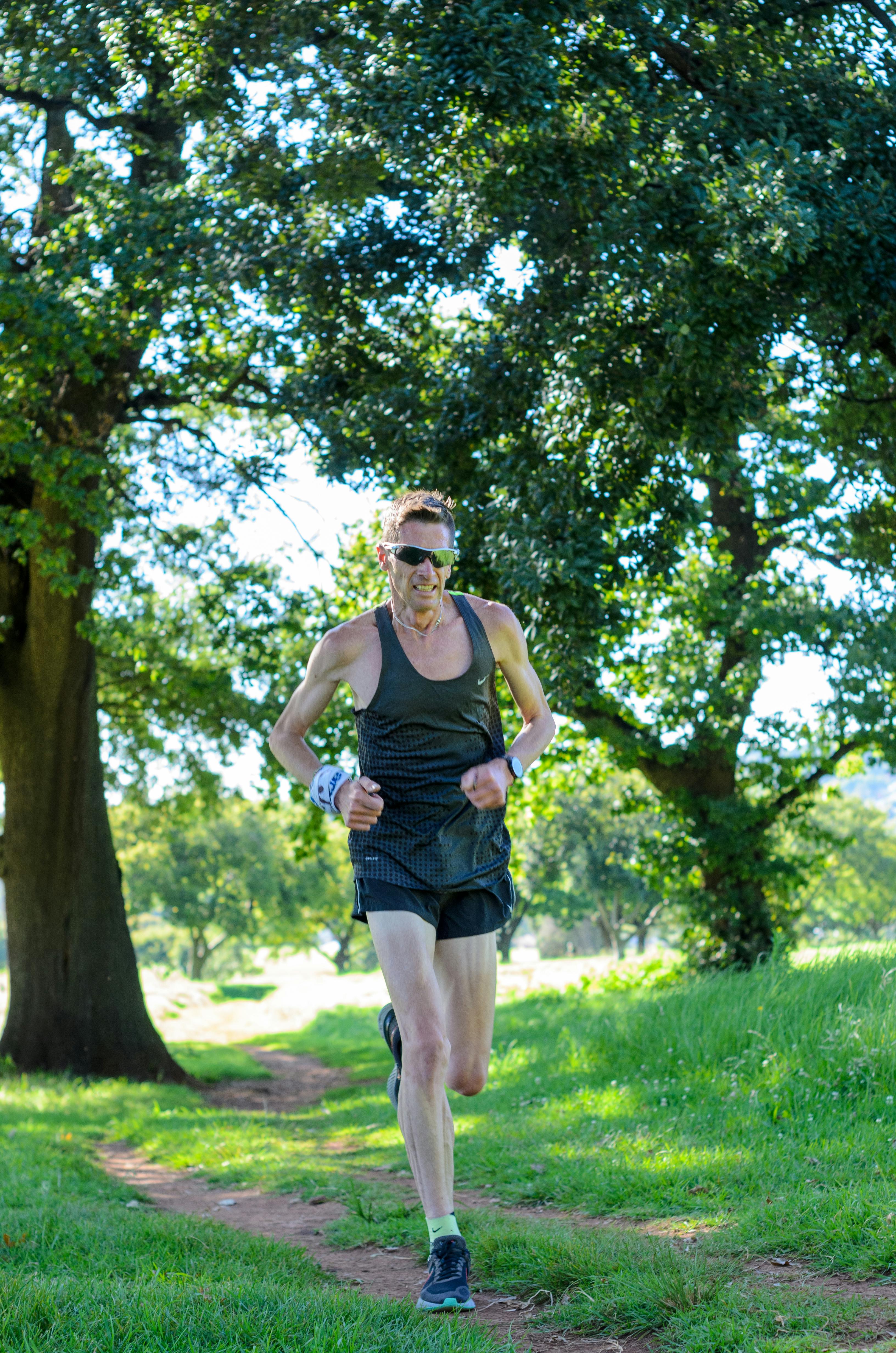 A Man Running on a Trail · Free Stock Photo