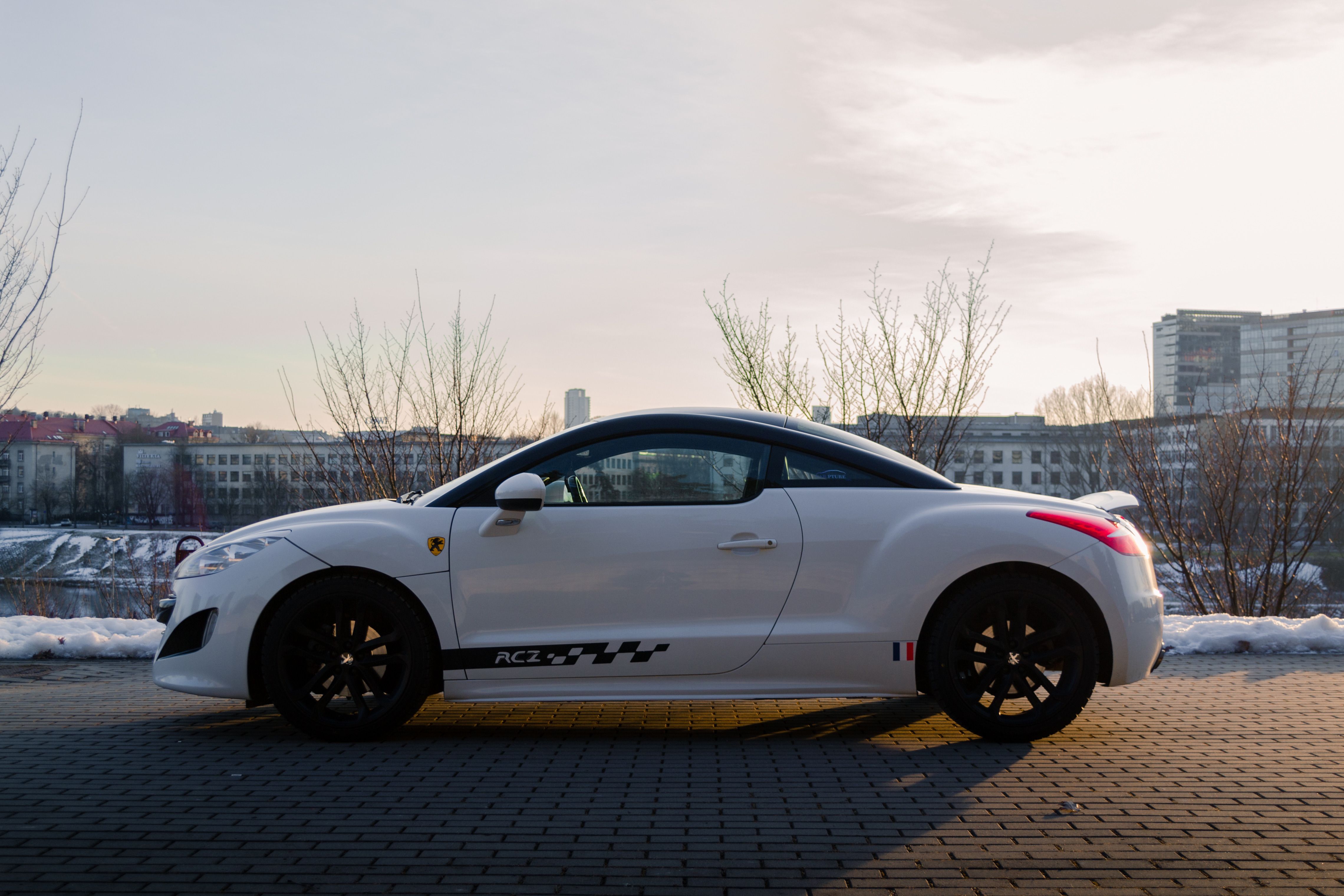 A White Car Parked on the Street · Free Stock Photo