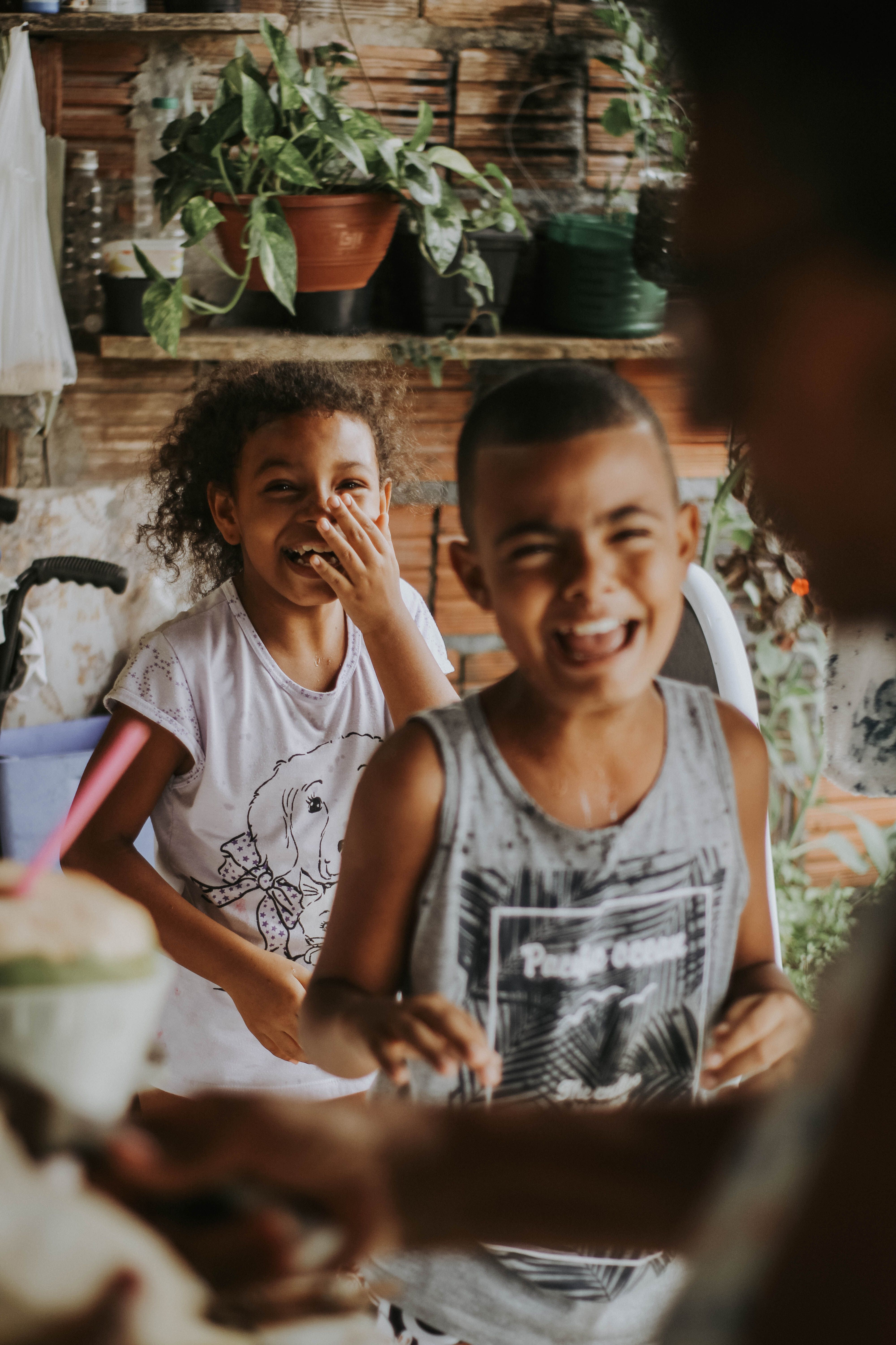 Siblings Laughing While Parent is Cooking · Free Stock Photo