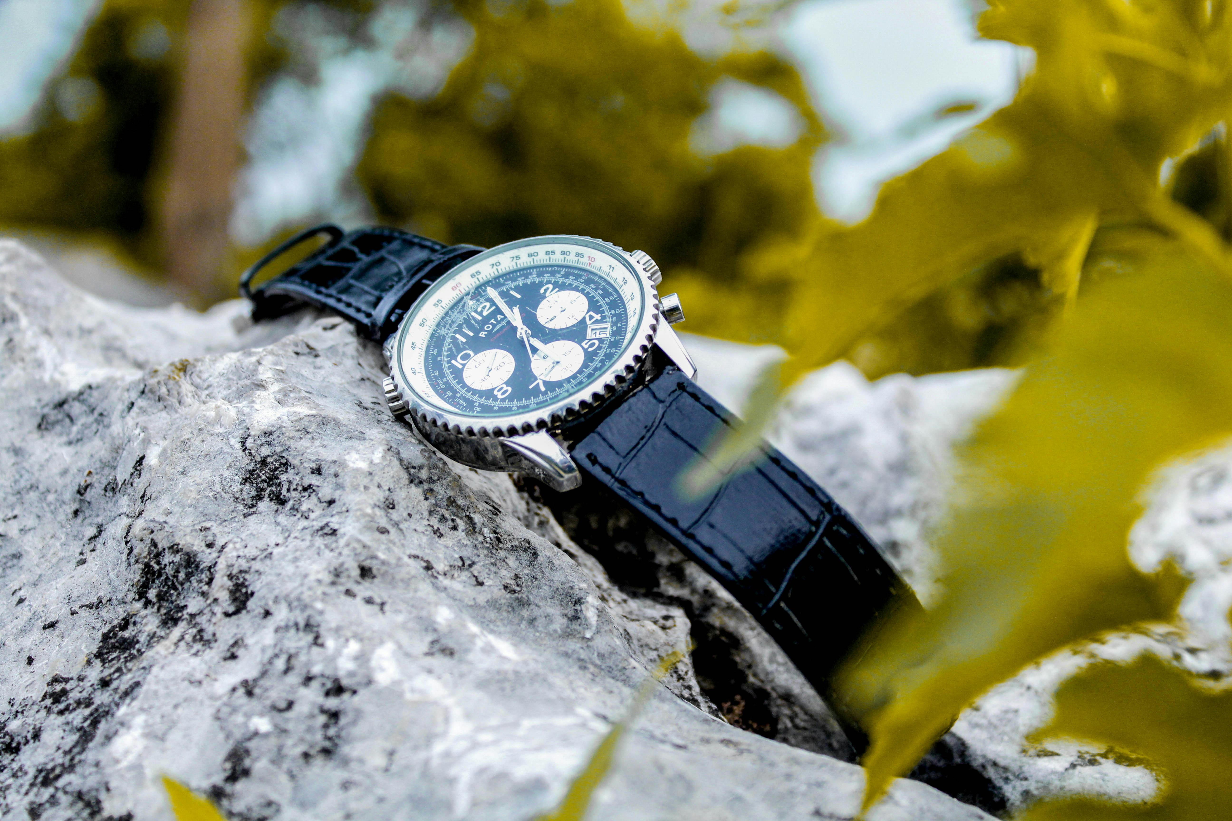 Selective Focus Photography of Chronograph Watch on Rock · Free Stock Photo