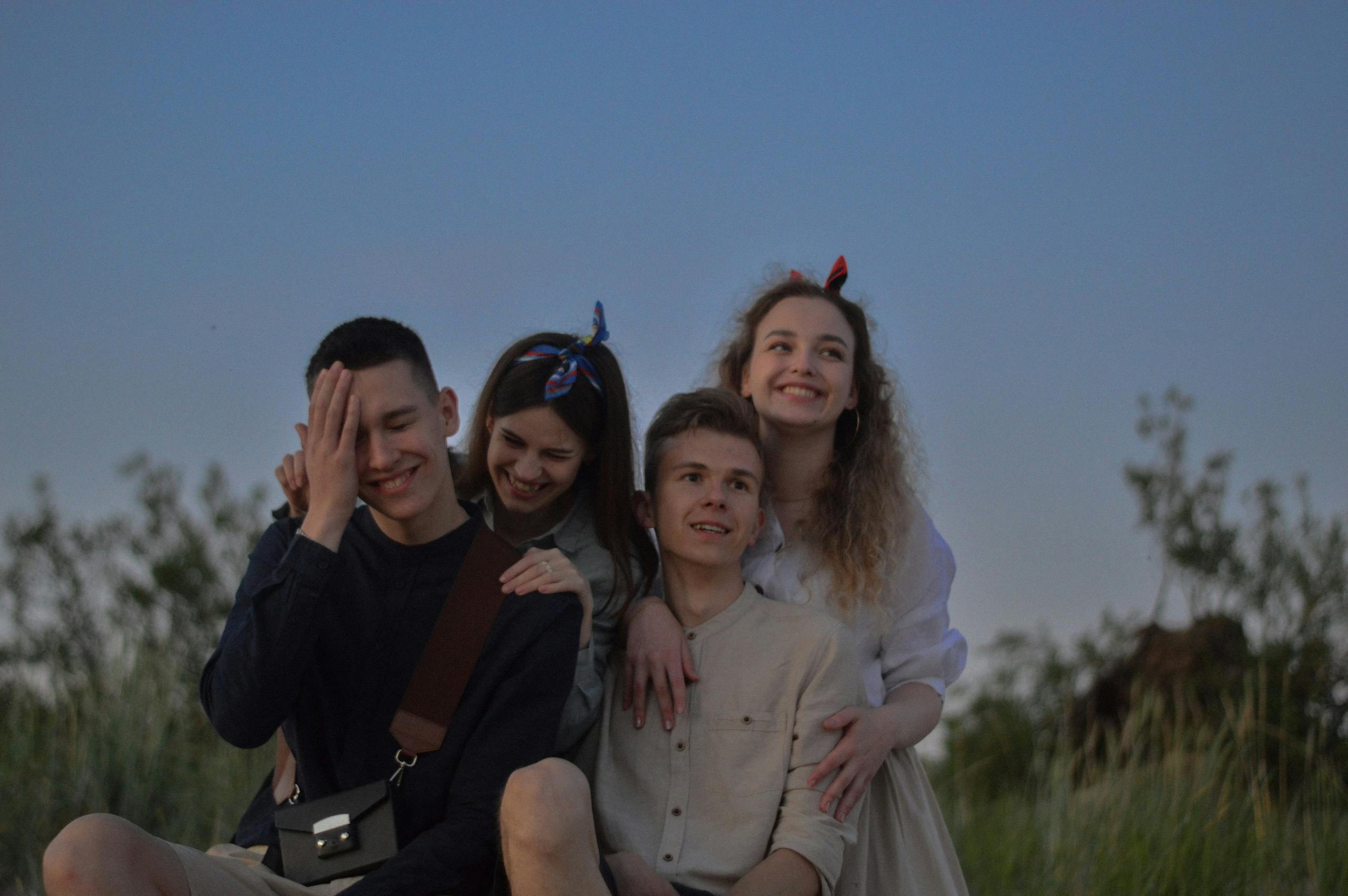 Five Person Across Sunset · Free Stock Photo