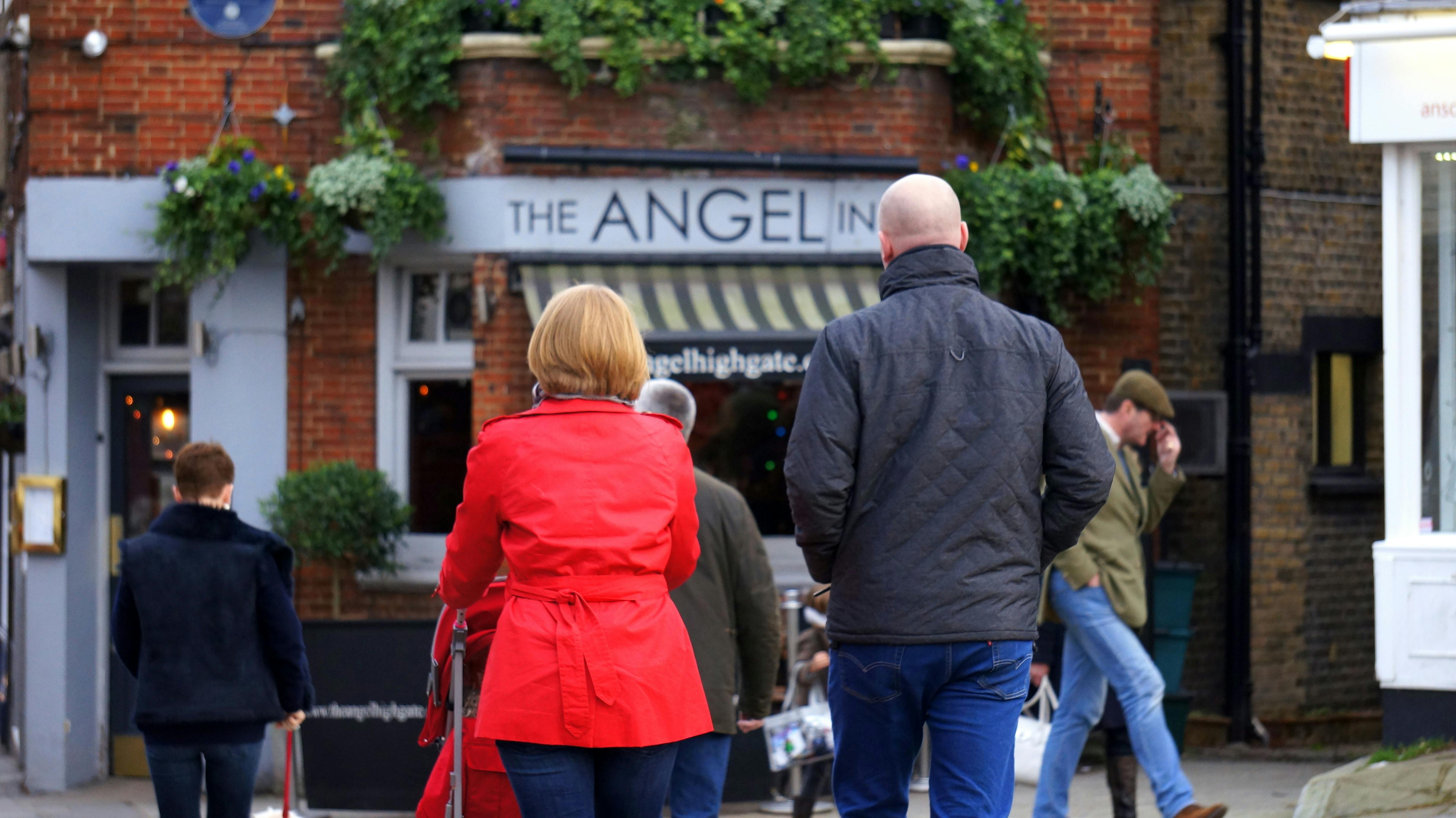 Group of People Walking in Front of Store · Free Stock Photo
