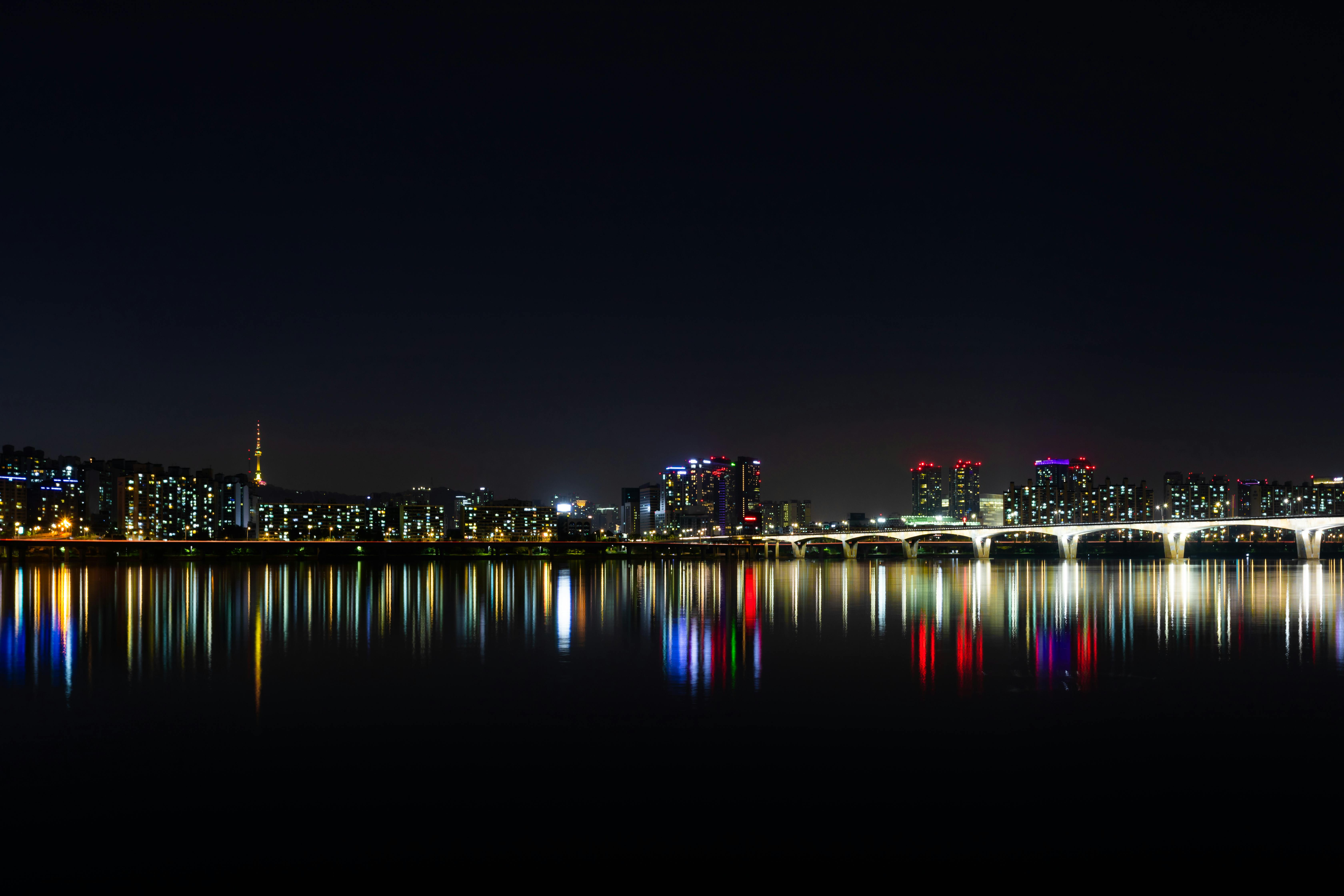 City Near Bodies of Water during Night Time · Free Stock Photo