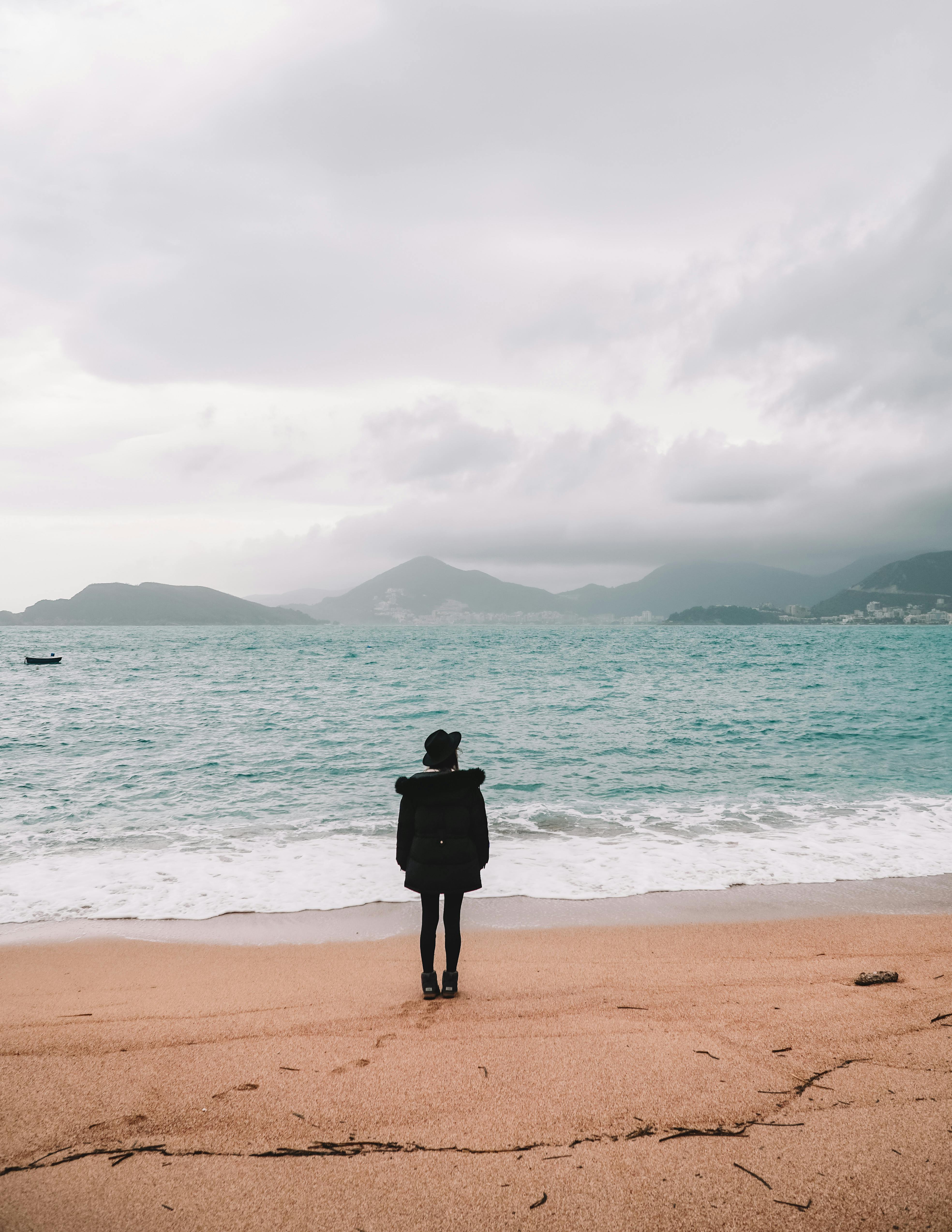Back View of Person Standing on the Beach · Free Stock Photo