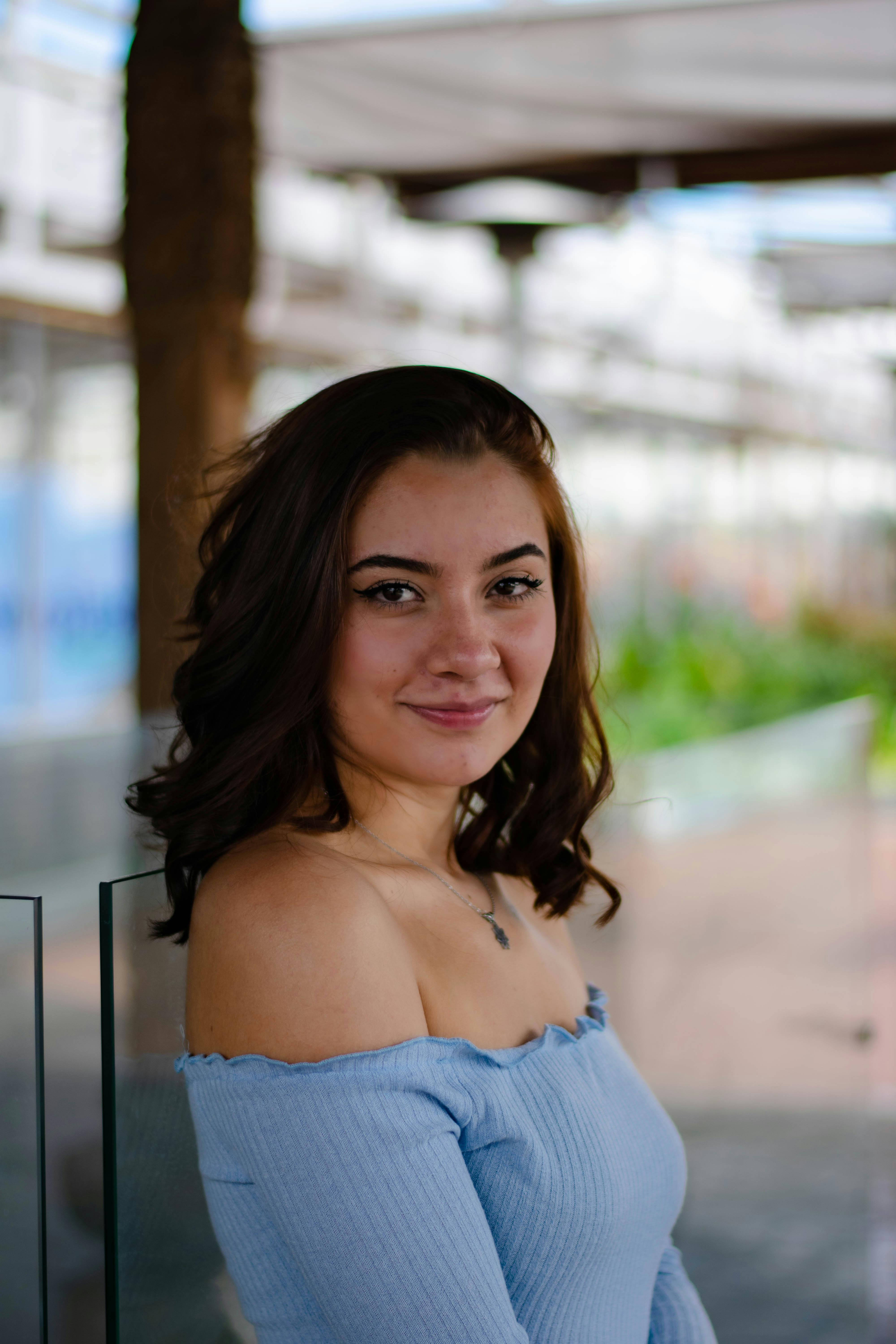 Portrait of a Smiling Girl Wearing Blue Top · Free Stock Photo