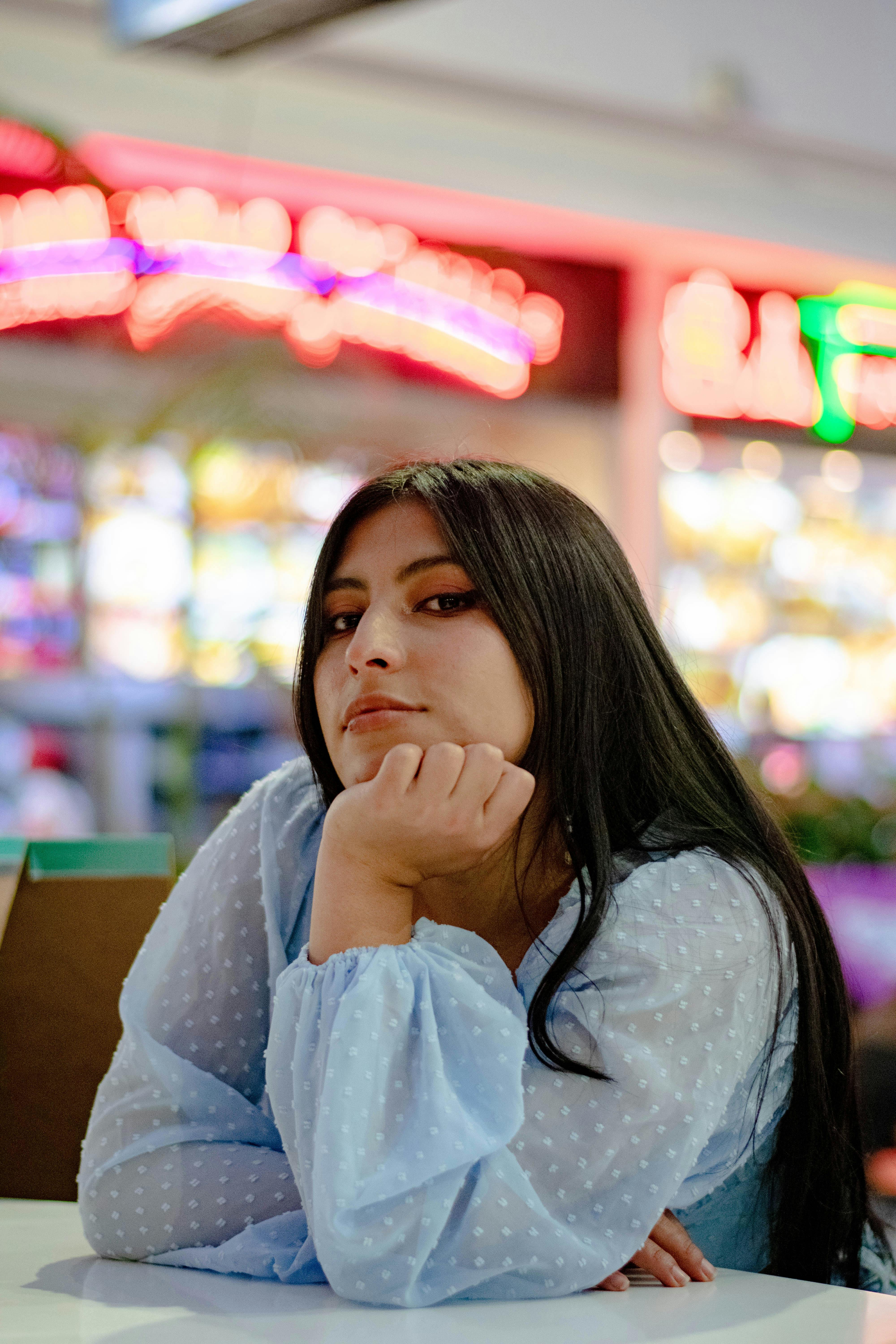 A Woman Leaning on Her Hand · Free Stock Photo