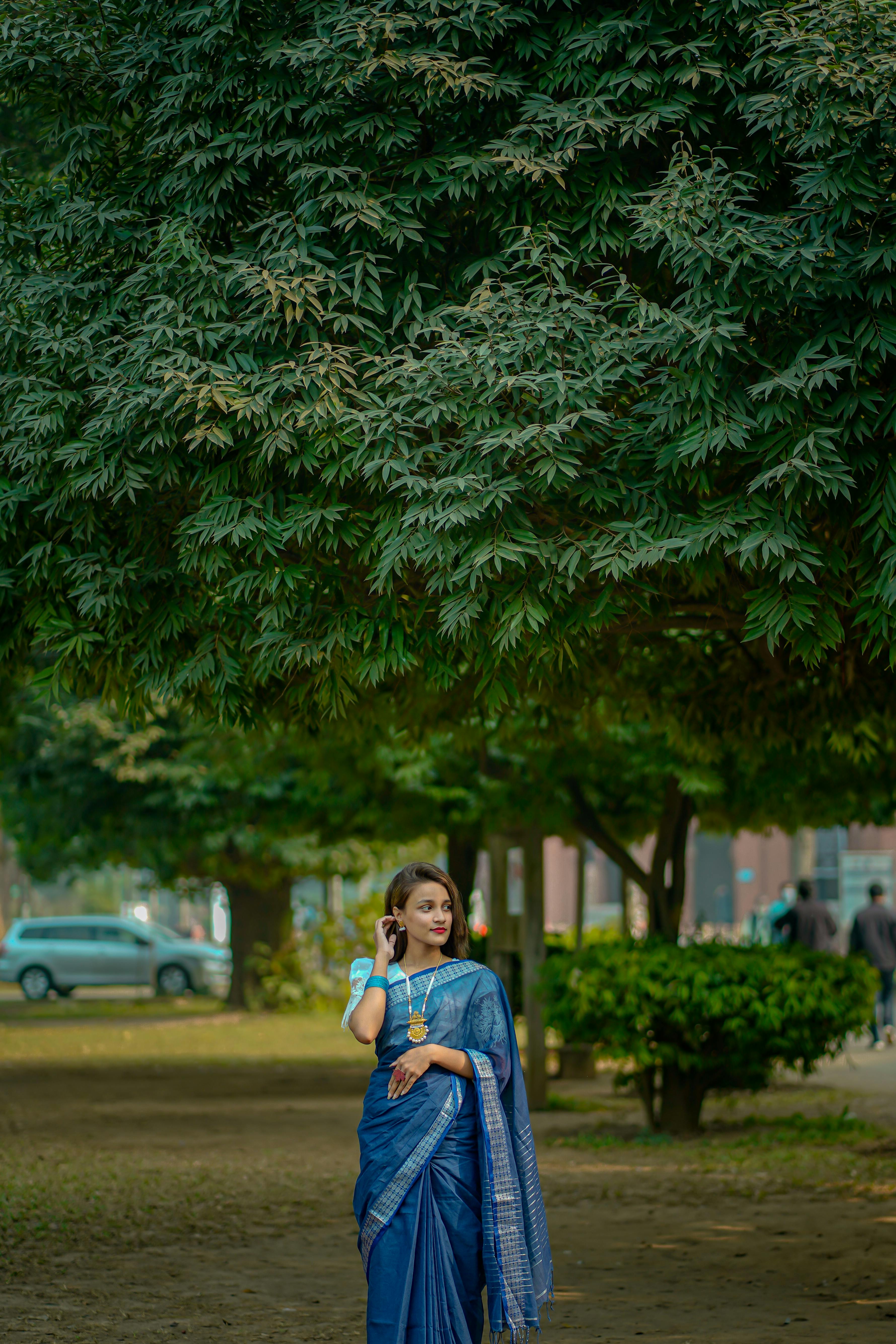 A Cute Little Baby in Traditional Clothing Sitting while Looking Afar ...