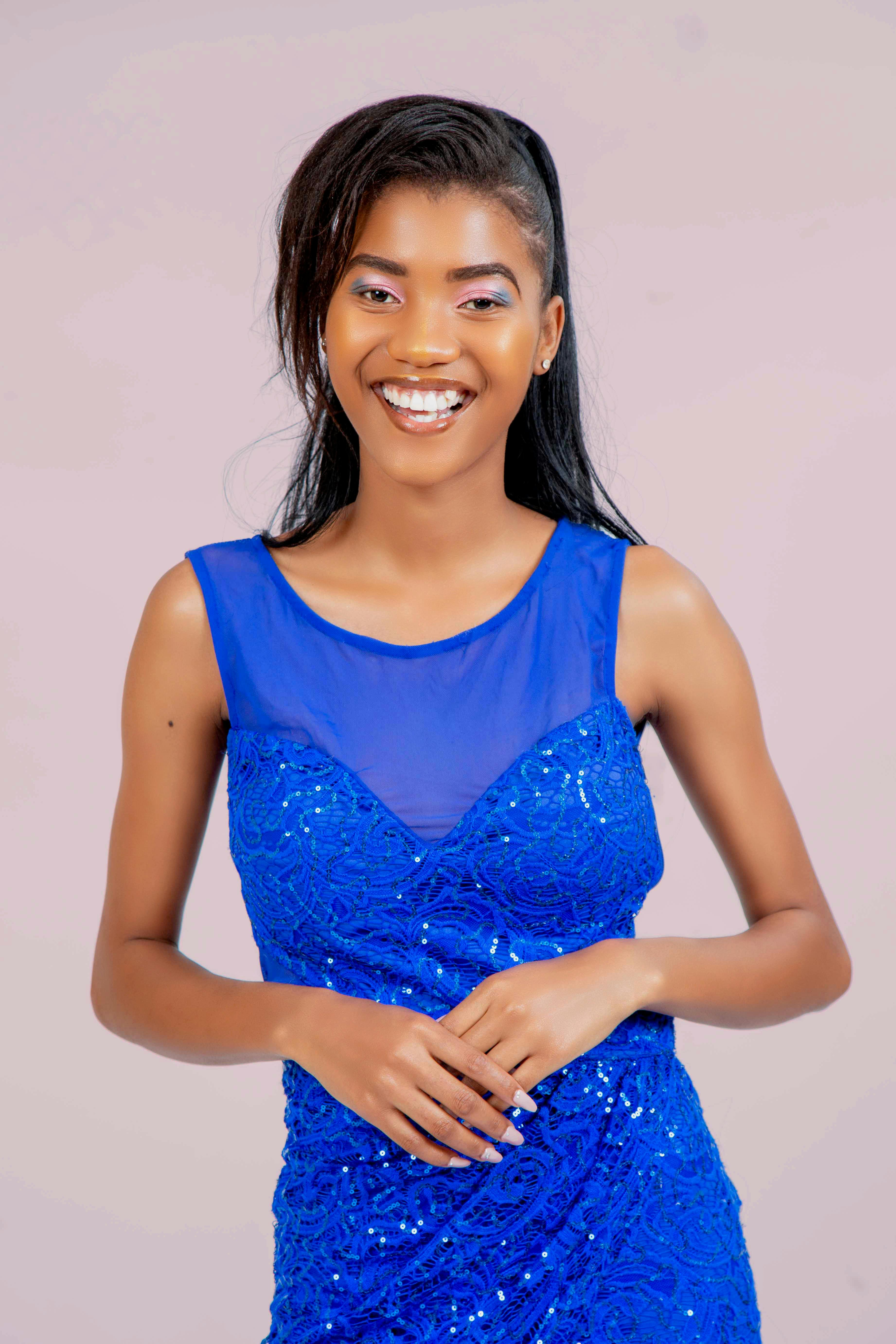 Woman in Blue Sleeveless Dress Smiling · Free Stock Photo