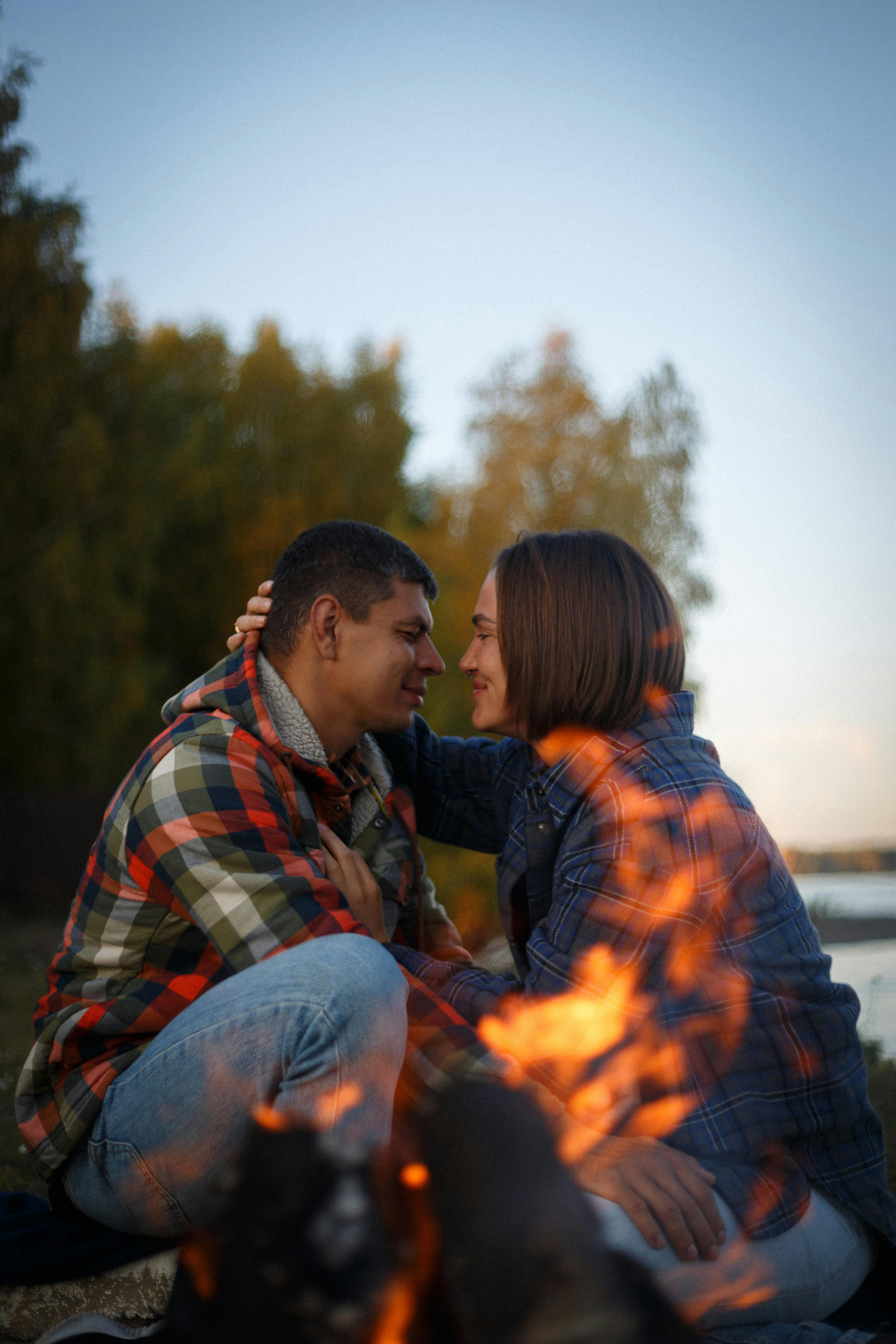A Couple Hugging by the Fire · Free Stock Photo