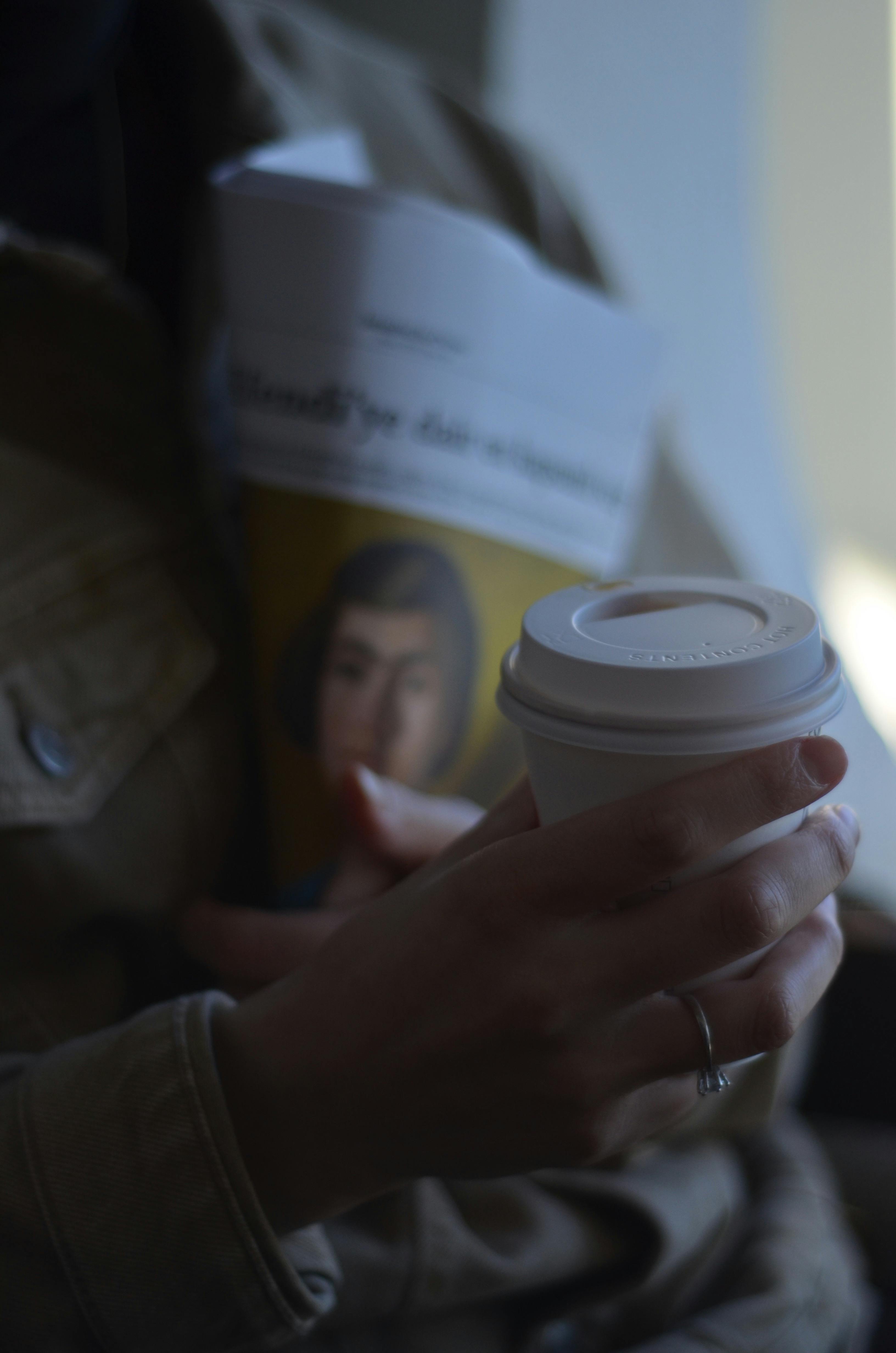 Close-Up Shot of a Person Holding a White Plastic Cup · Free Stock Photo