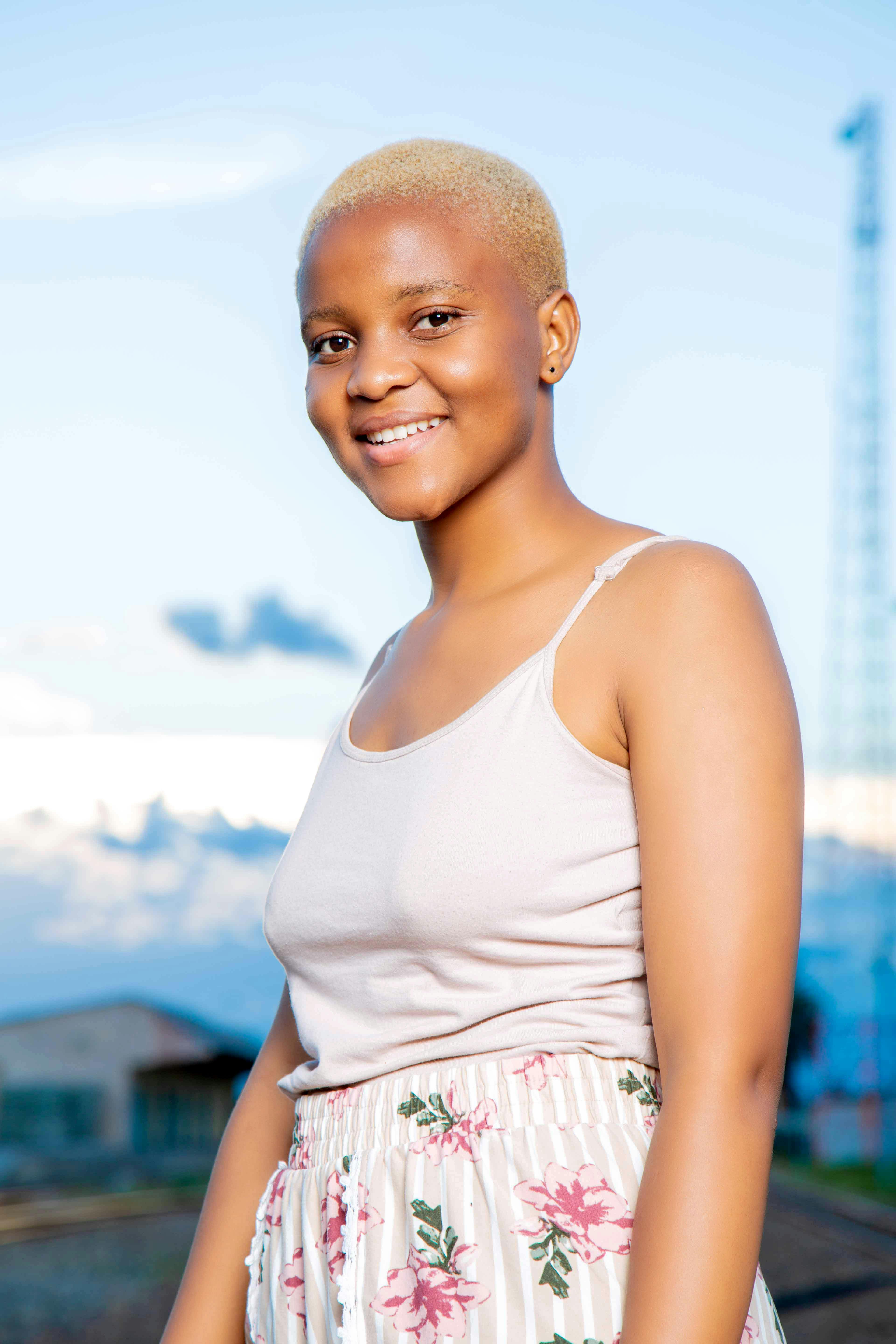 Girl Standing in an Arcade · Free Stock Photo