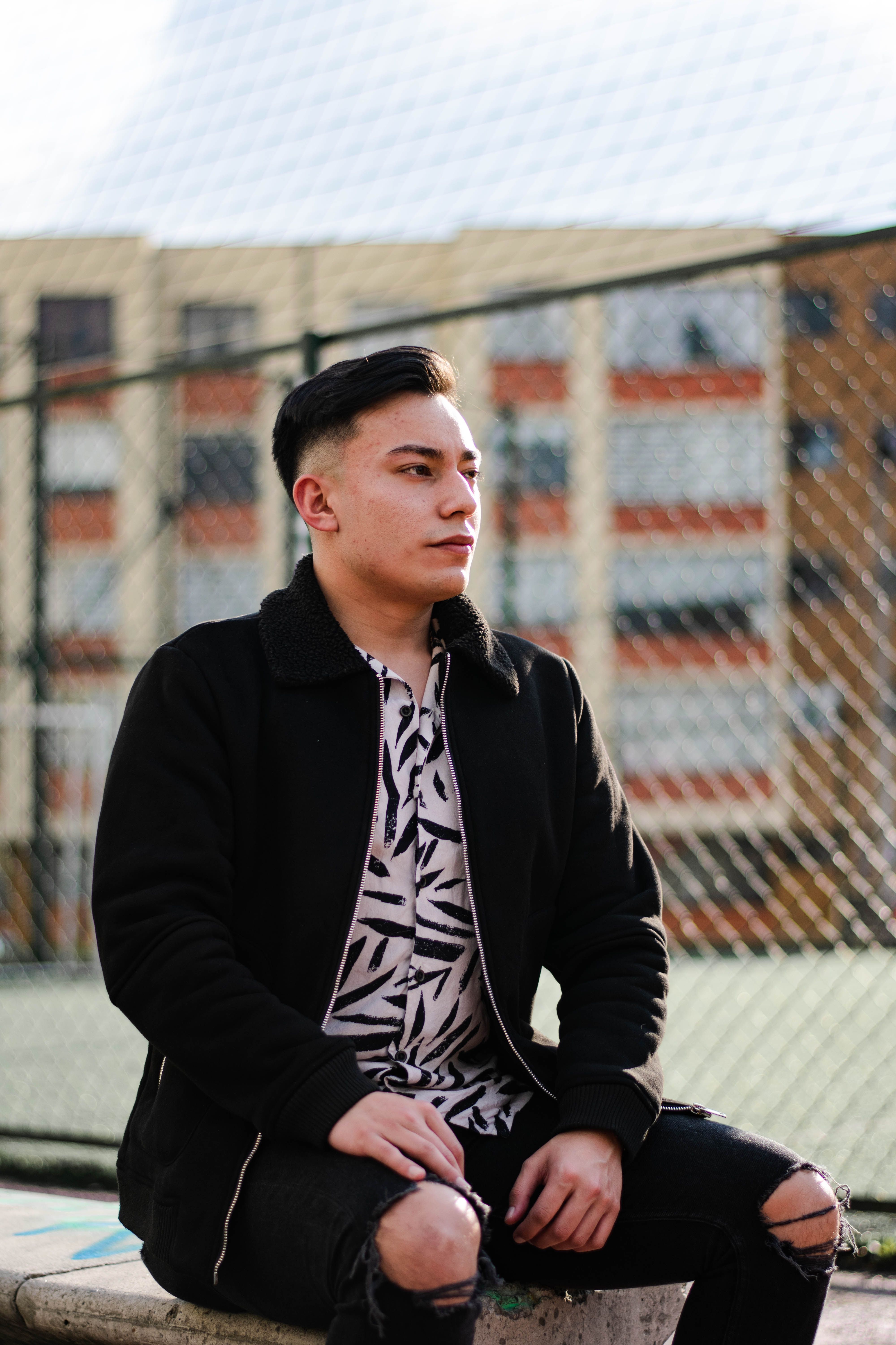 Man Wearing Jacket Sitting on Bench · Free Stock Photo