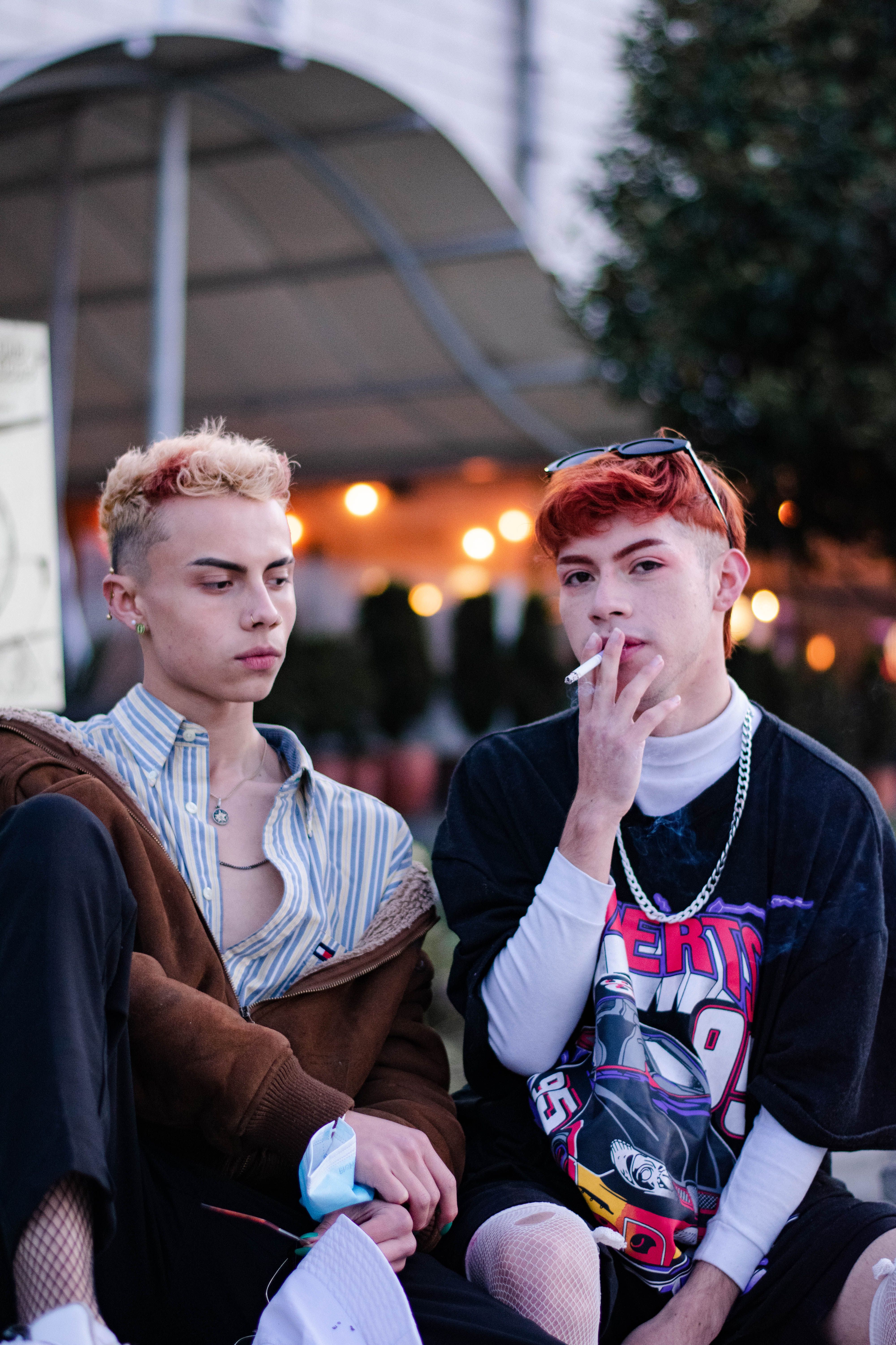 Young Men Sitting Casual Wear Smoking Cigarette · Free Stock Photo