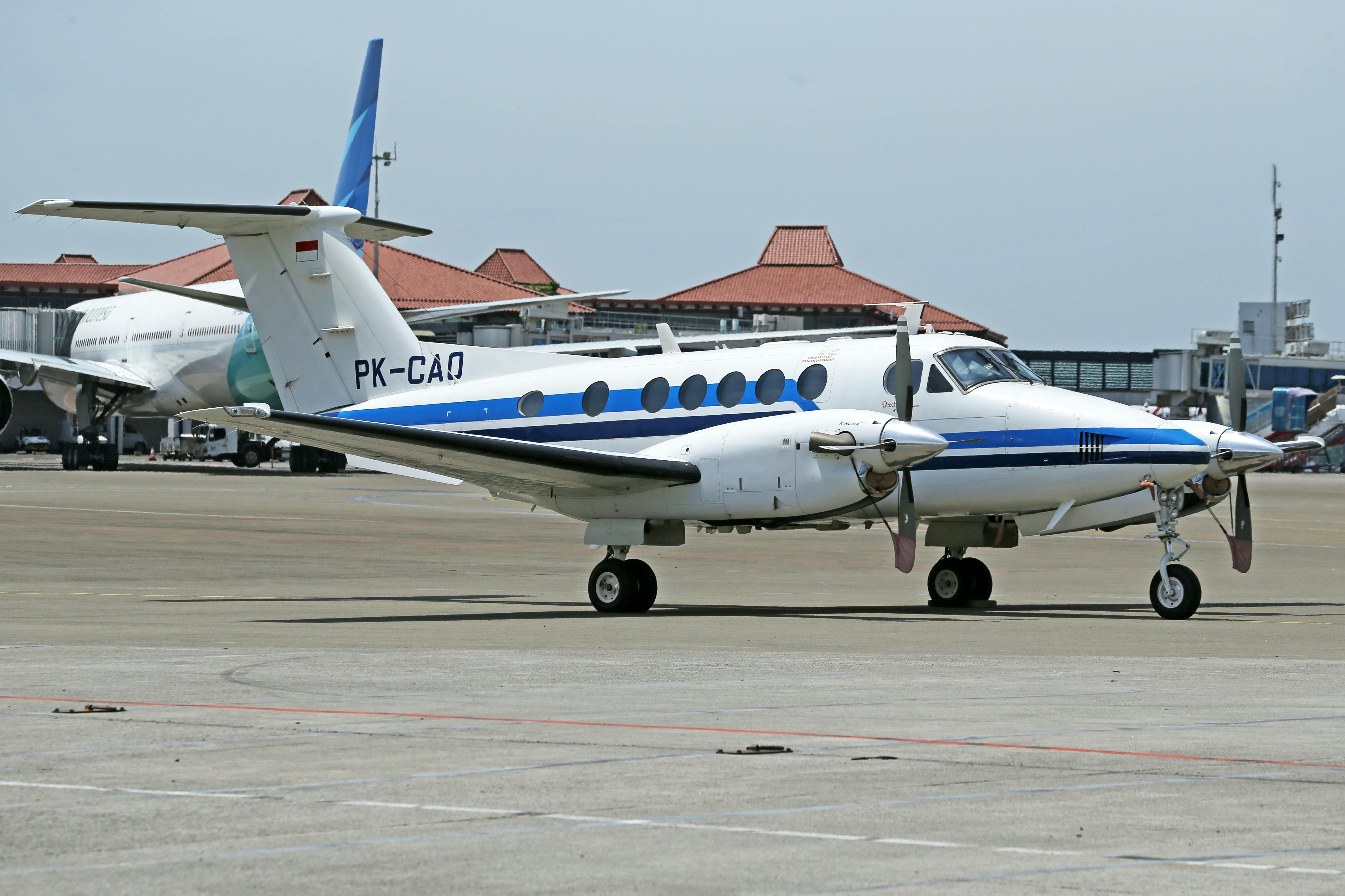 Blue and White Aircraft on Ground · Free Stock Photo