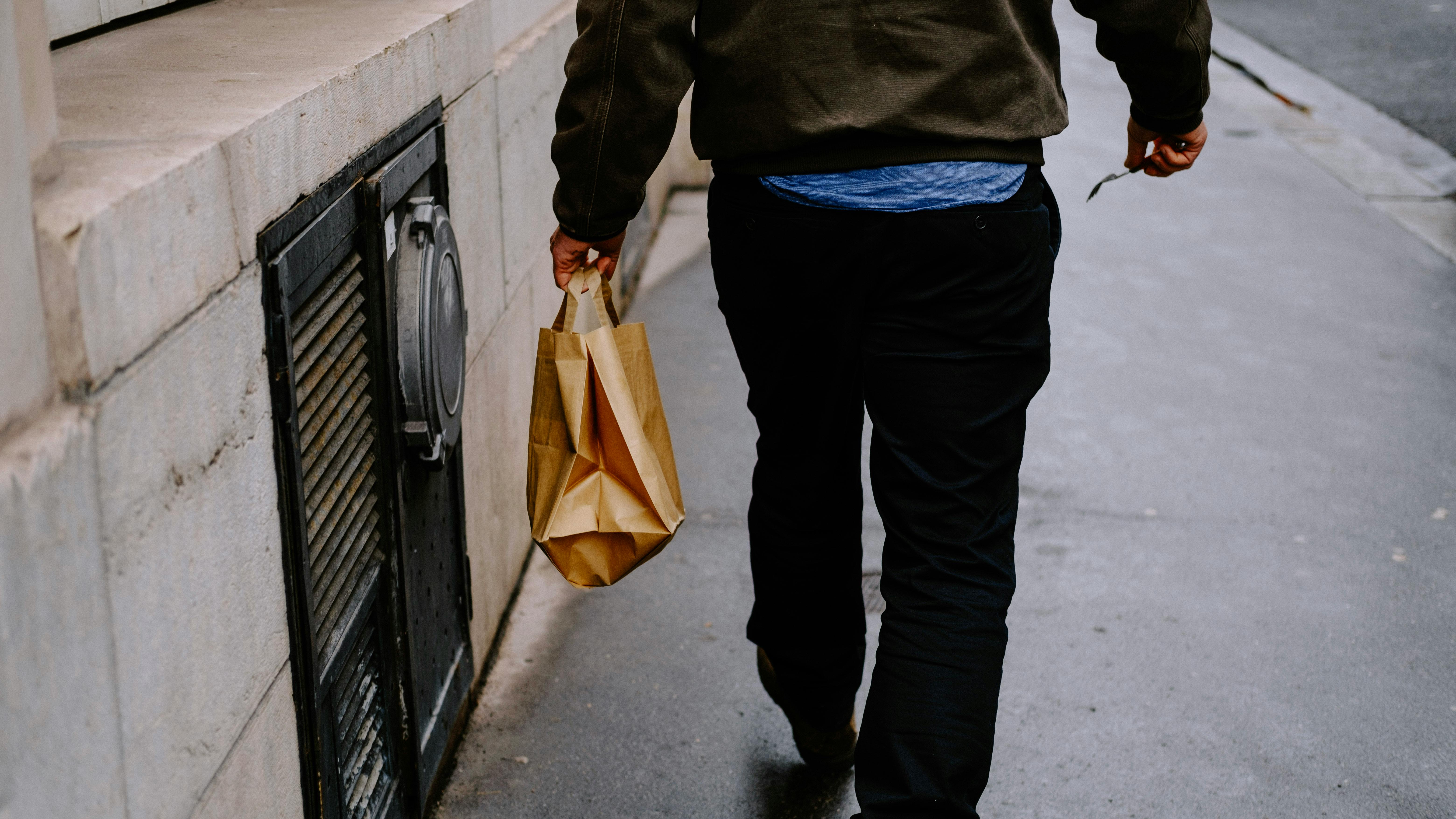 Stylish Woman Walking Street with Shopping Bag · Free Stock Photo