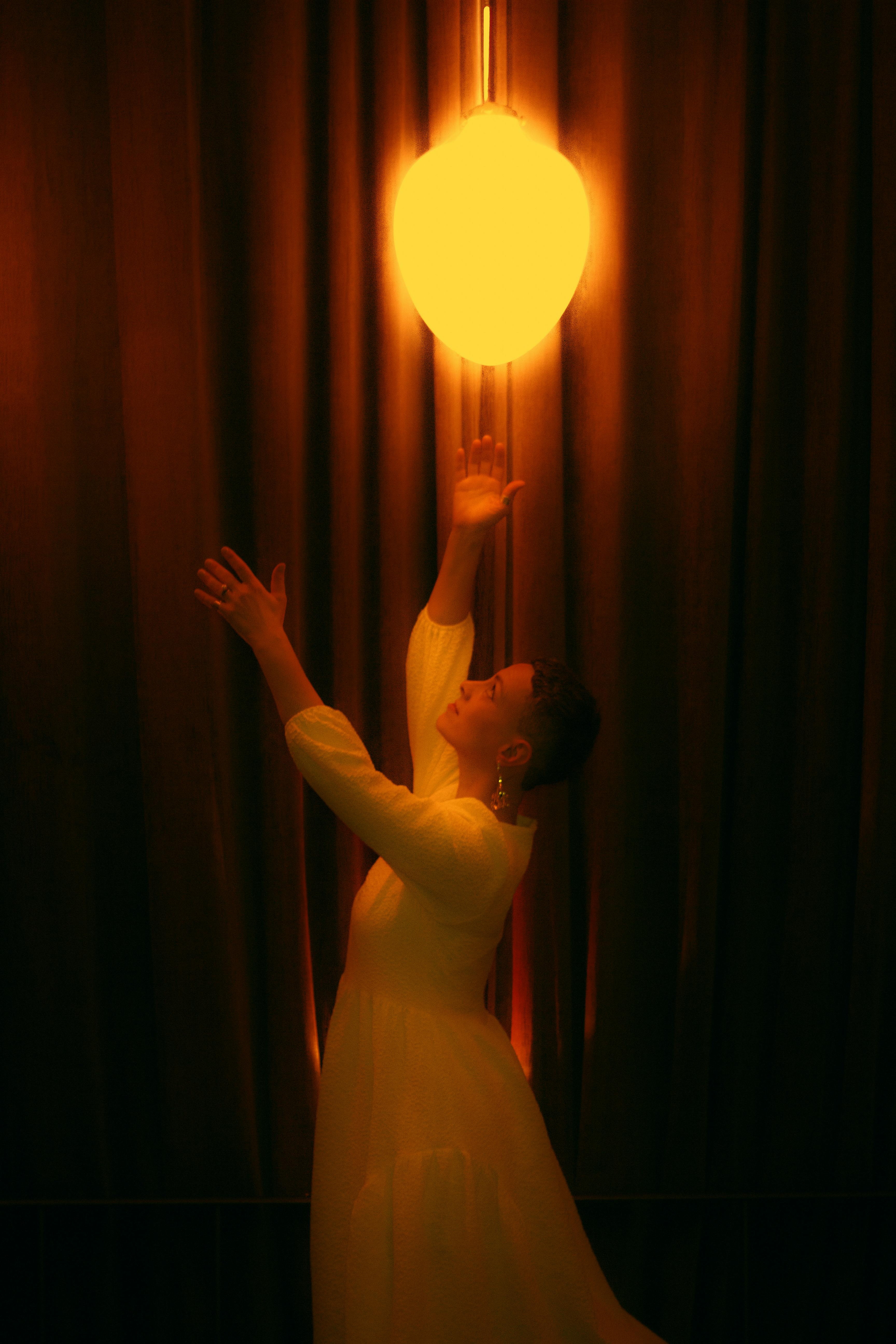 Woman Dancing under Lamp · Free Stock Photo