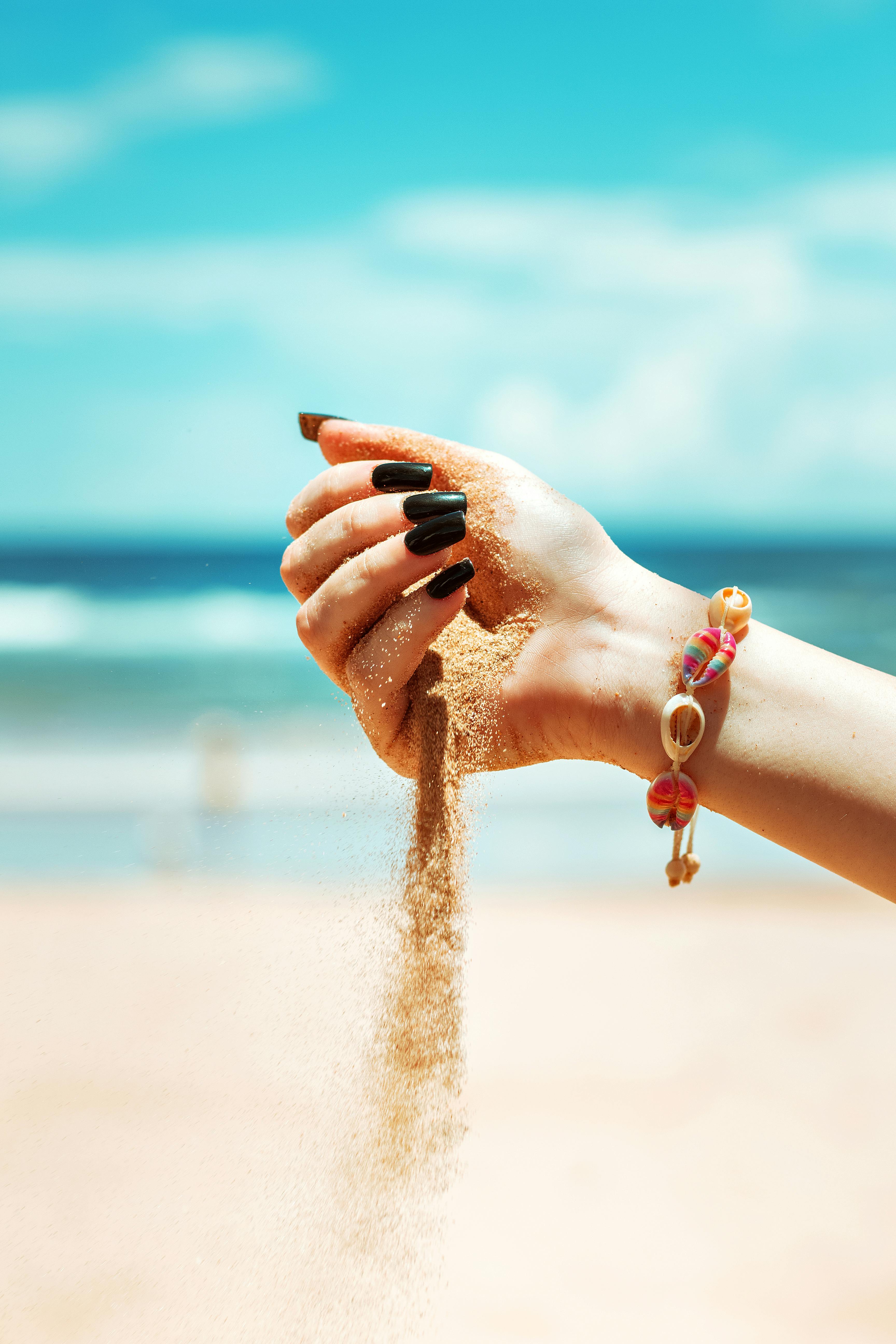 Hand Pouring Sand · Free Stock Photo