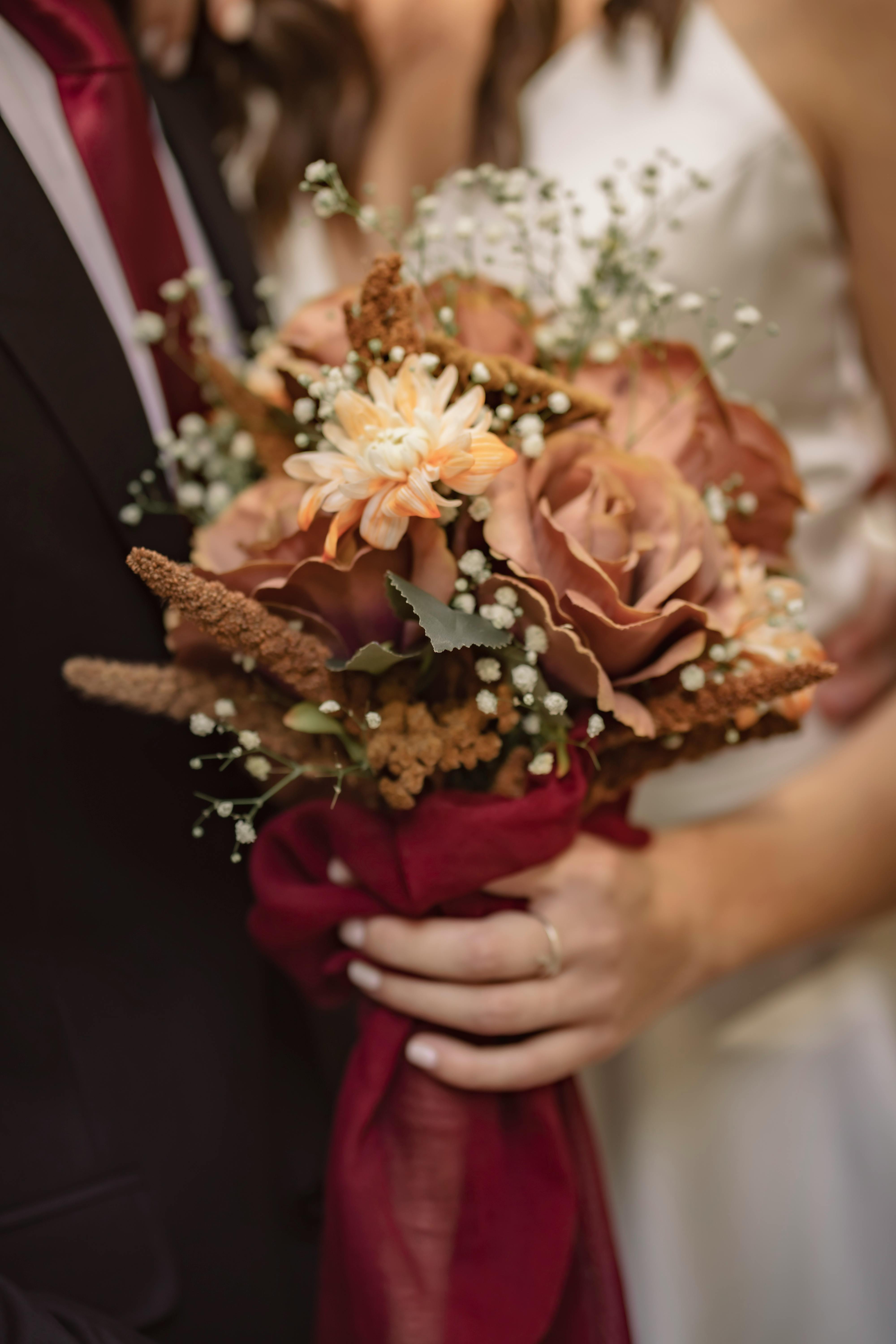 Bride Holding Bouquet of Flowers Beside the Groom · Free Stock Photo