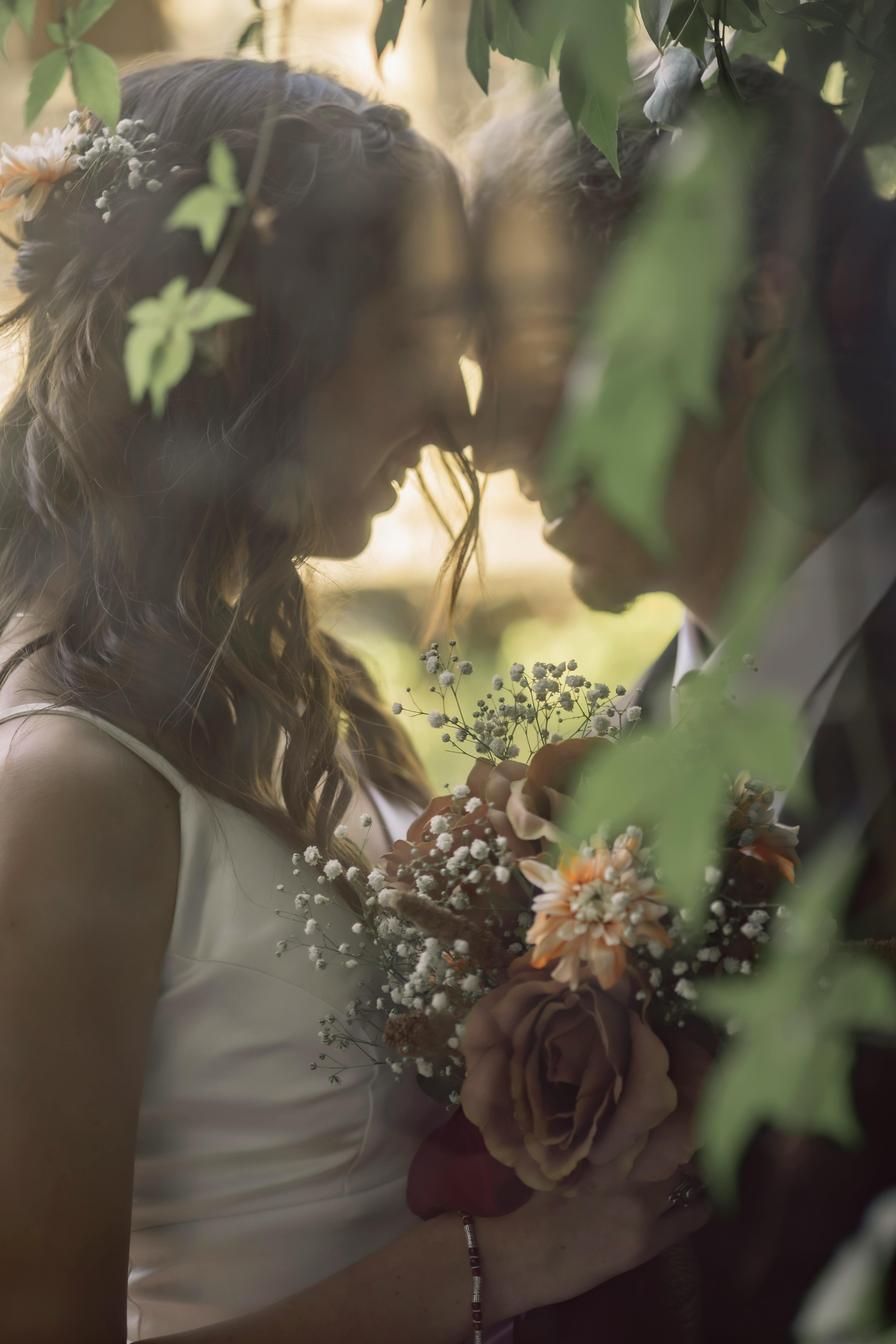 Groom Kissing the Bride on the Forehead · Free Stock Photo