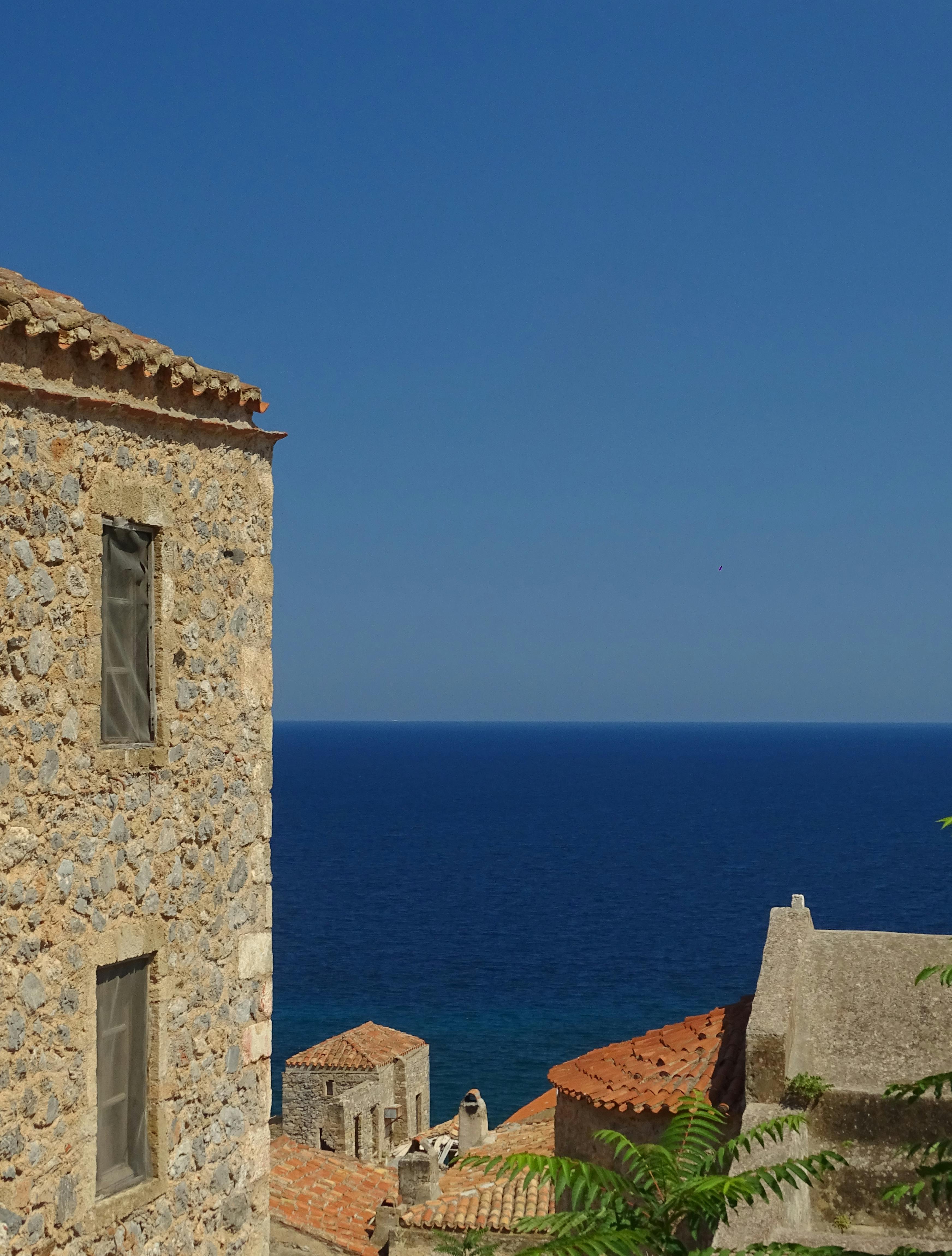 Traditional Stone Building on Sea Shore · Free Stock Photo