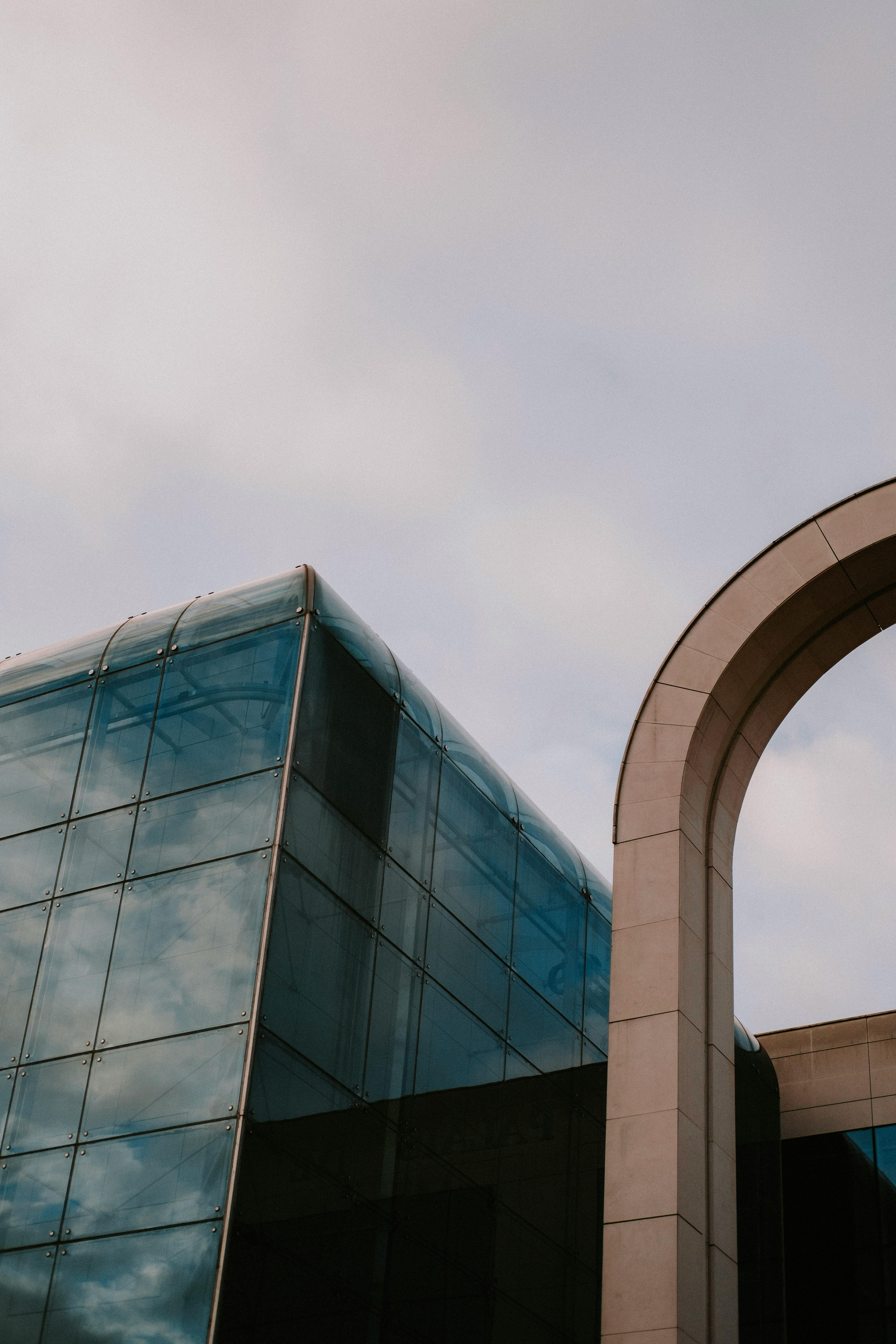 Glass Building Under the Gray Sky · Free Stock Photo