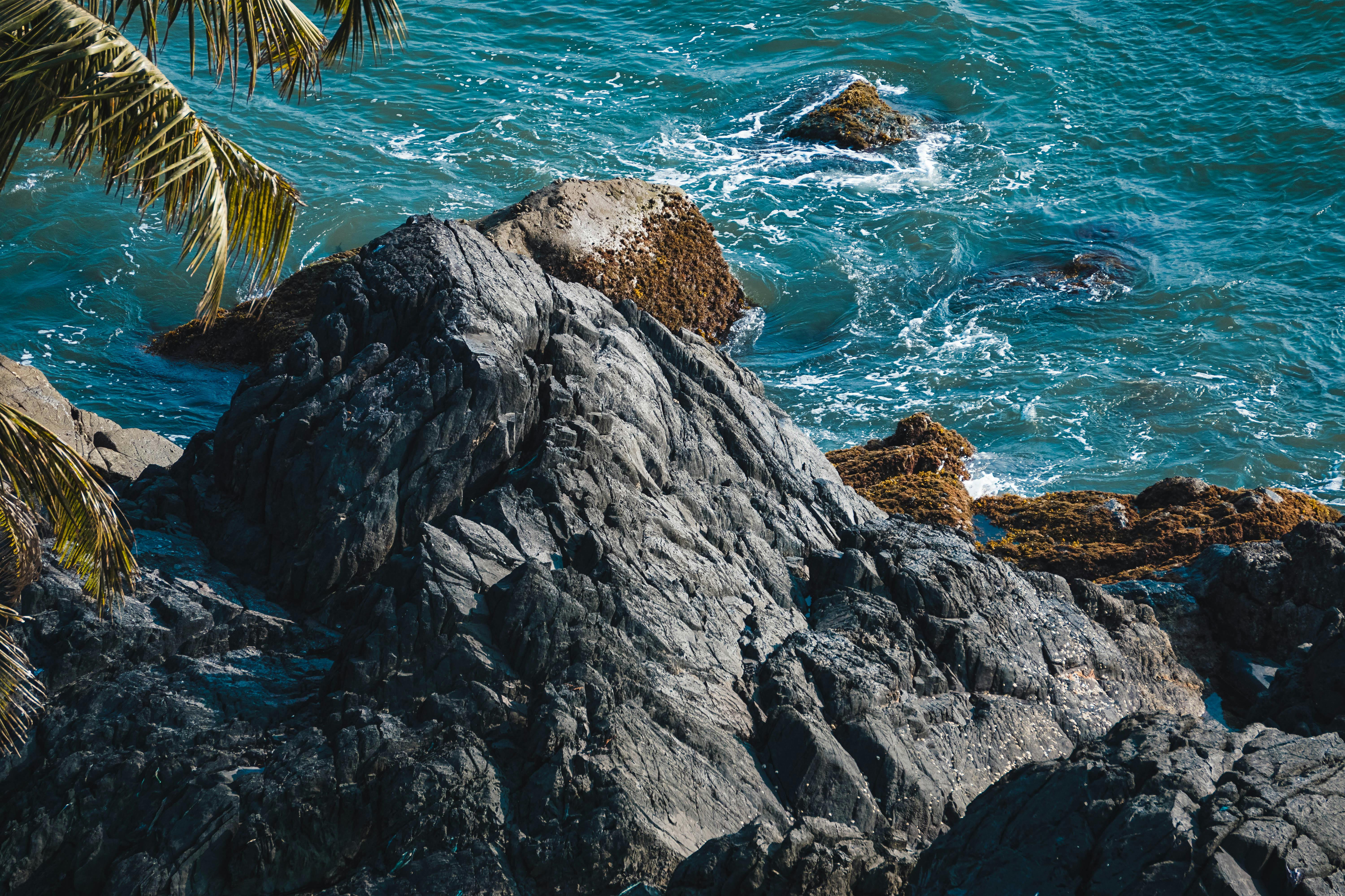 Black Rock Natural Formation Front of Sea · Free Stock Photo